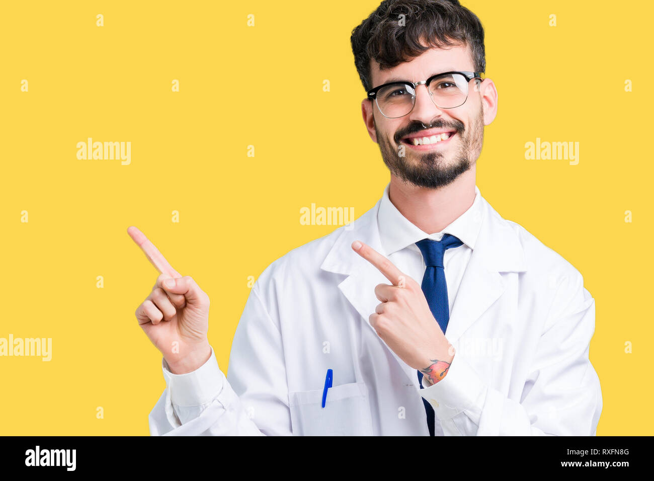 Young professional scientist man wearing white coat over isolated ...