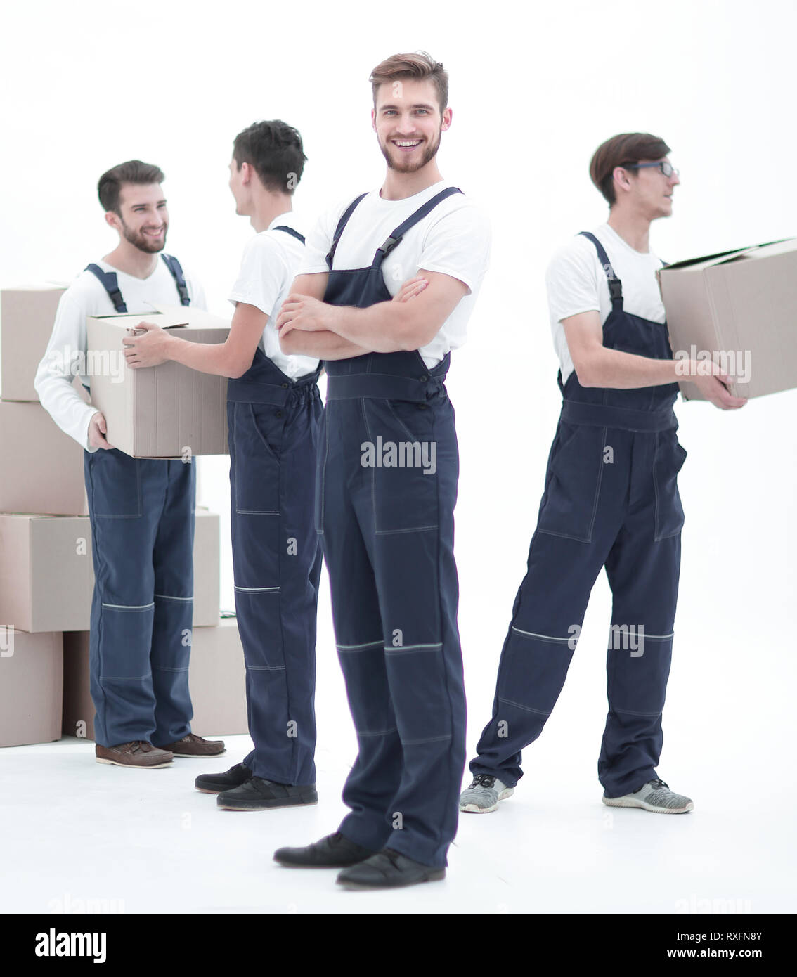 The team of responsible movers and their smiling leader Stock Photo - Alamy