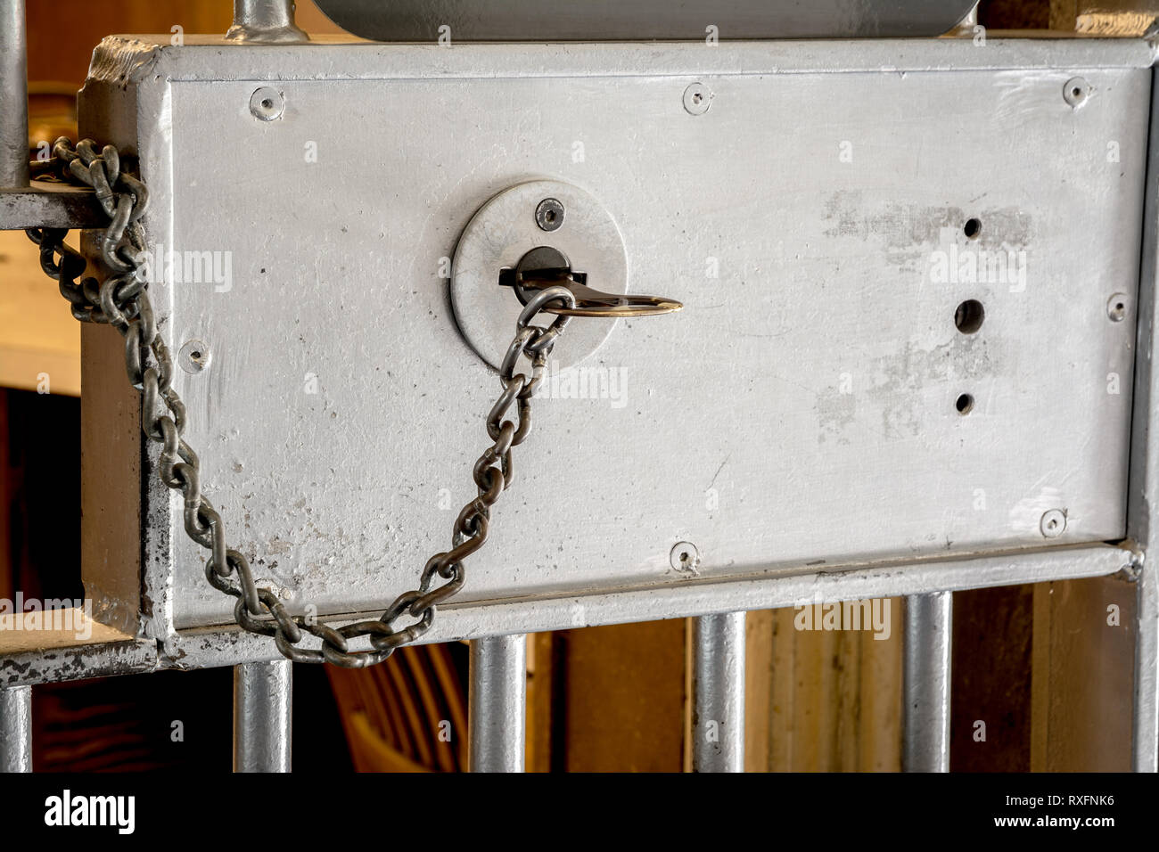 Gray painted Prison door lock with a brass key inserted Stock Photo - Alamy