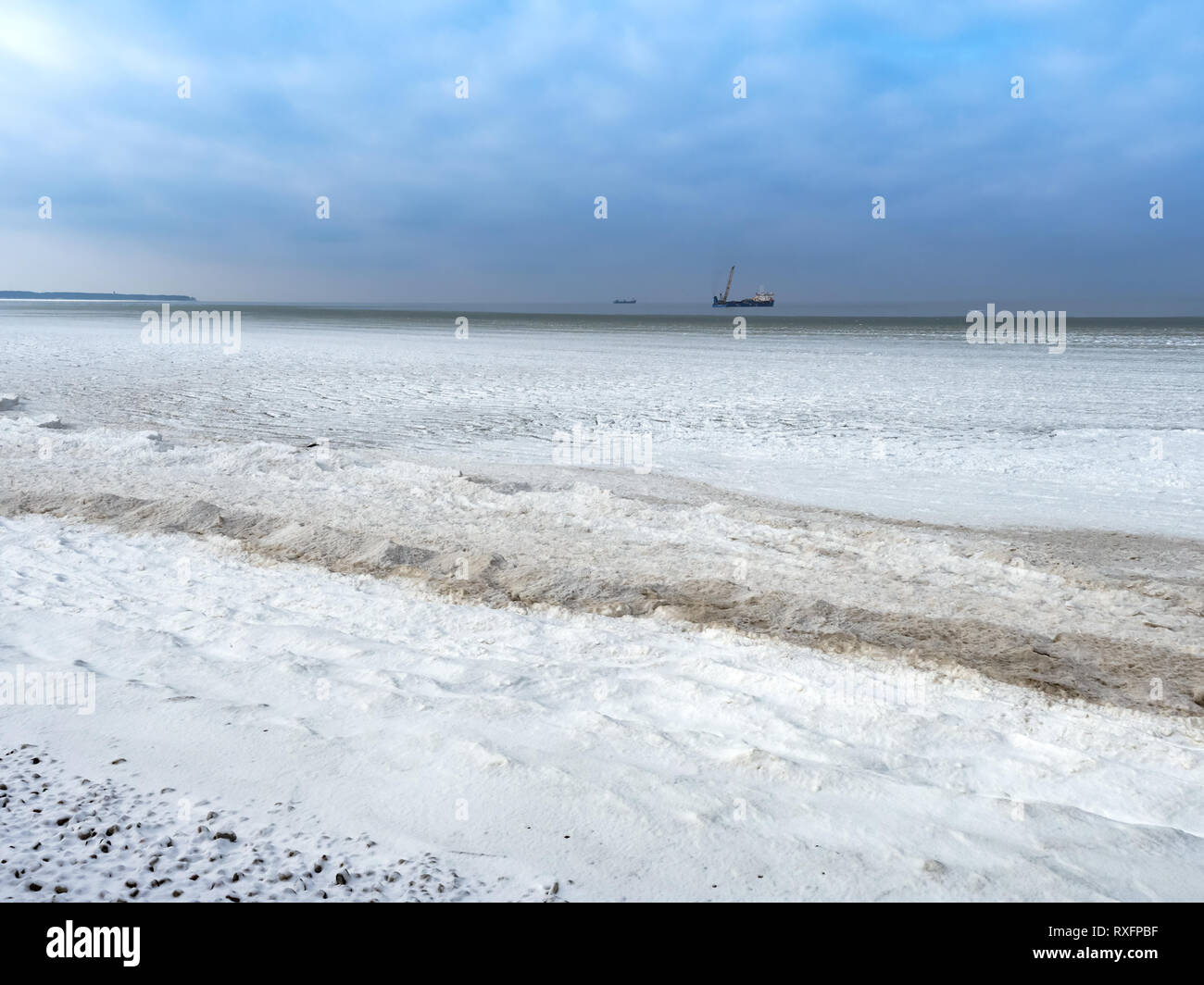 ice sludge in the sea, winter sea and a ship on the horizon Stock Photo ...