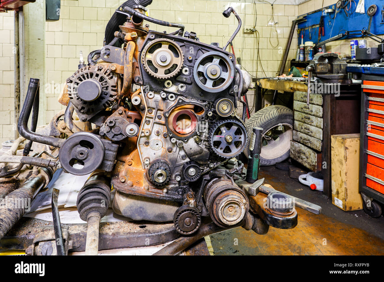 car engine repair in old service, removed dirty engine from car Stock ...