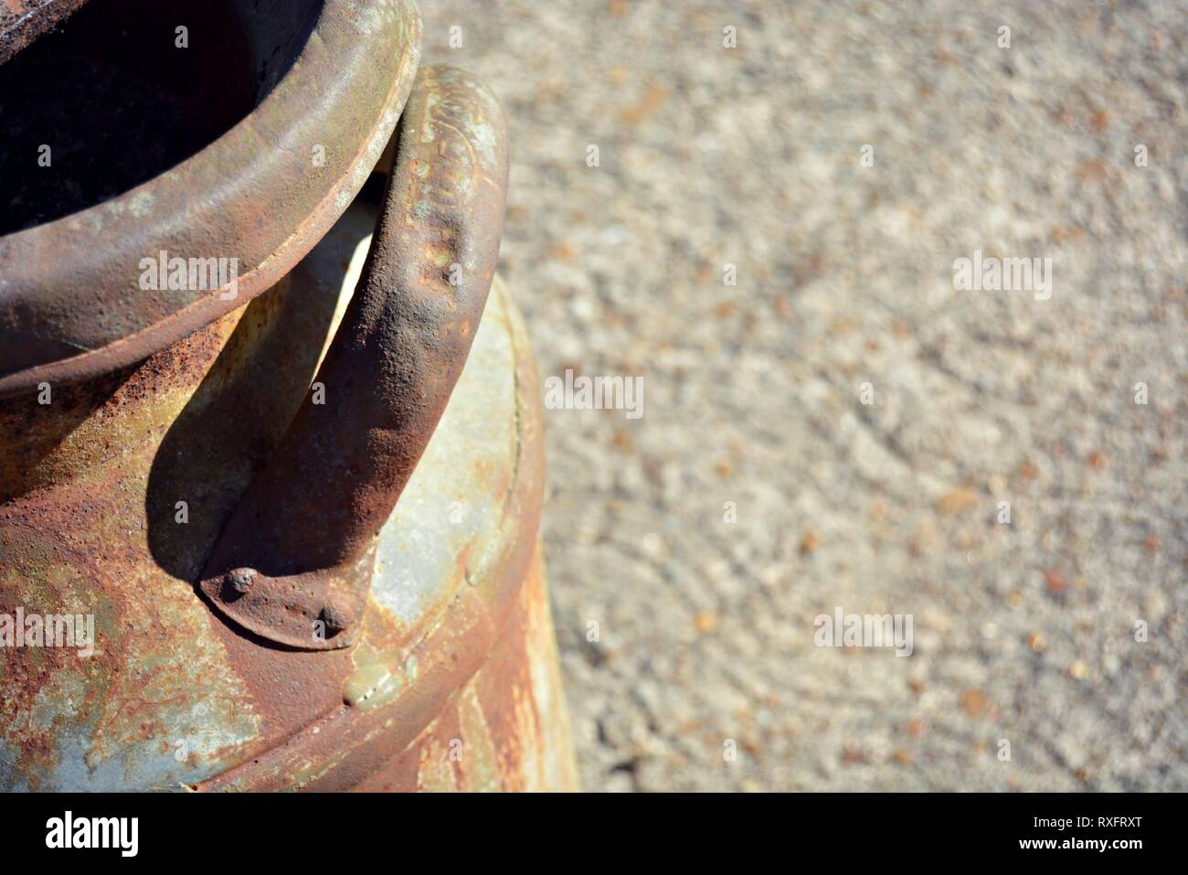 Old grey rusting milk can Stock Photo - Alamy