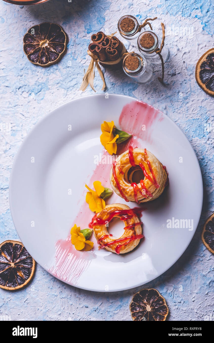 Vertical photo with top view on several donuts made from puff pastry ...