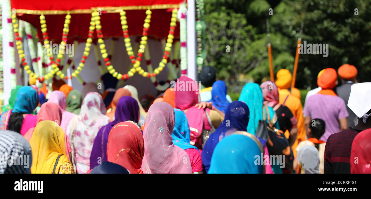 religious sikh rite with turbaned men and veiled women Stock Photo - Alamy