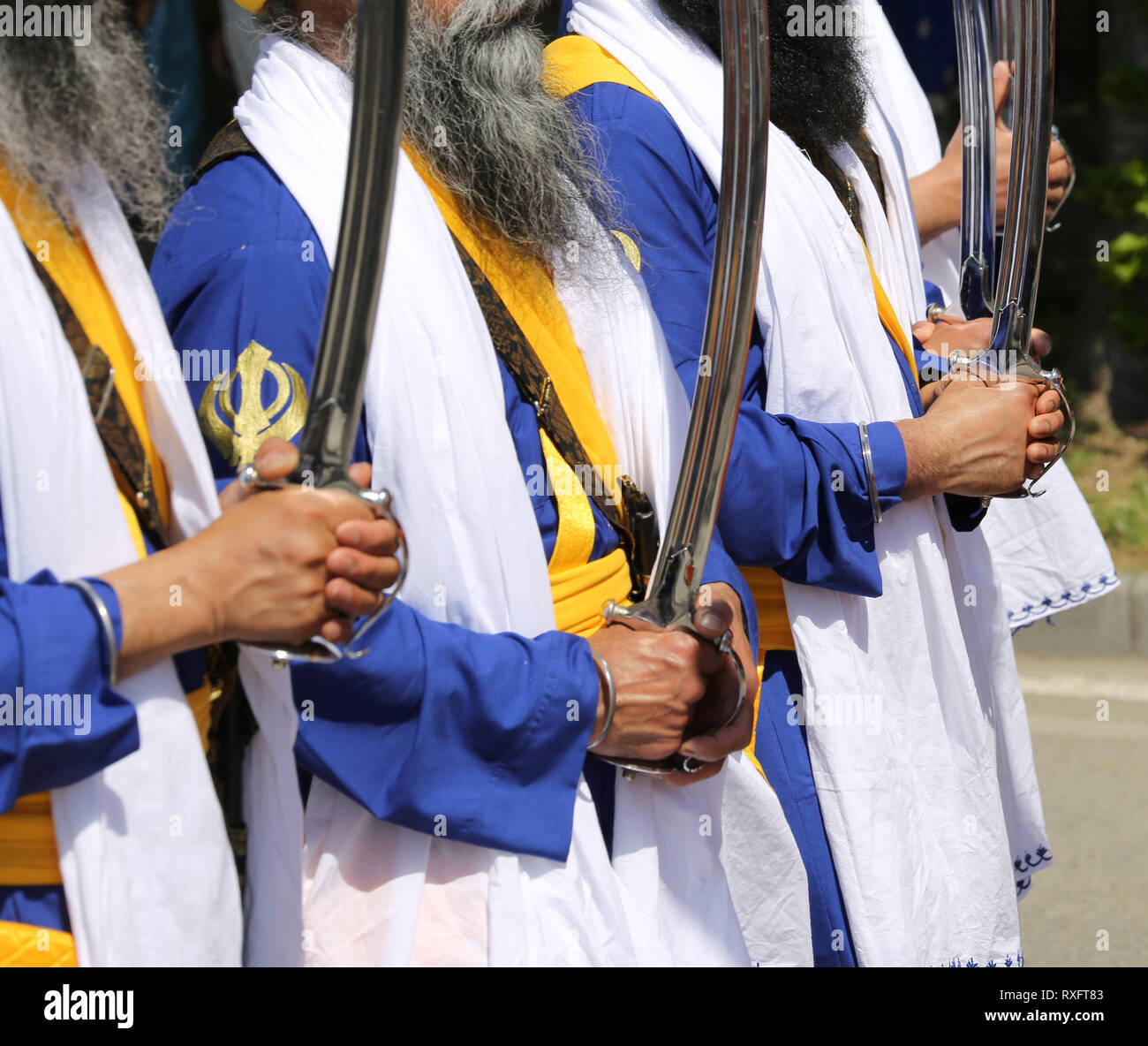 bearded Sikh men with swords in hands during a parade Stock Photo - Alamy