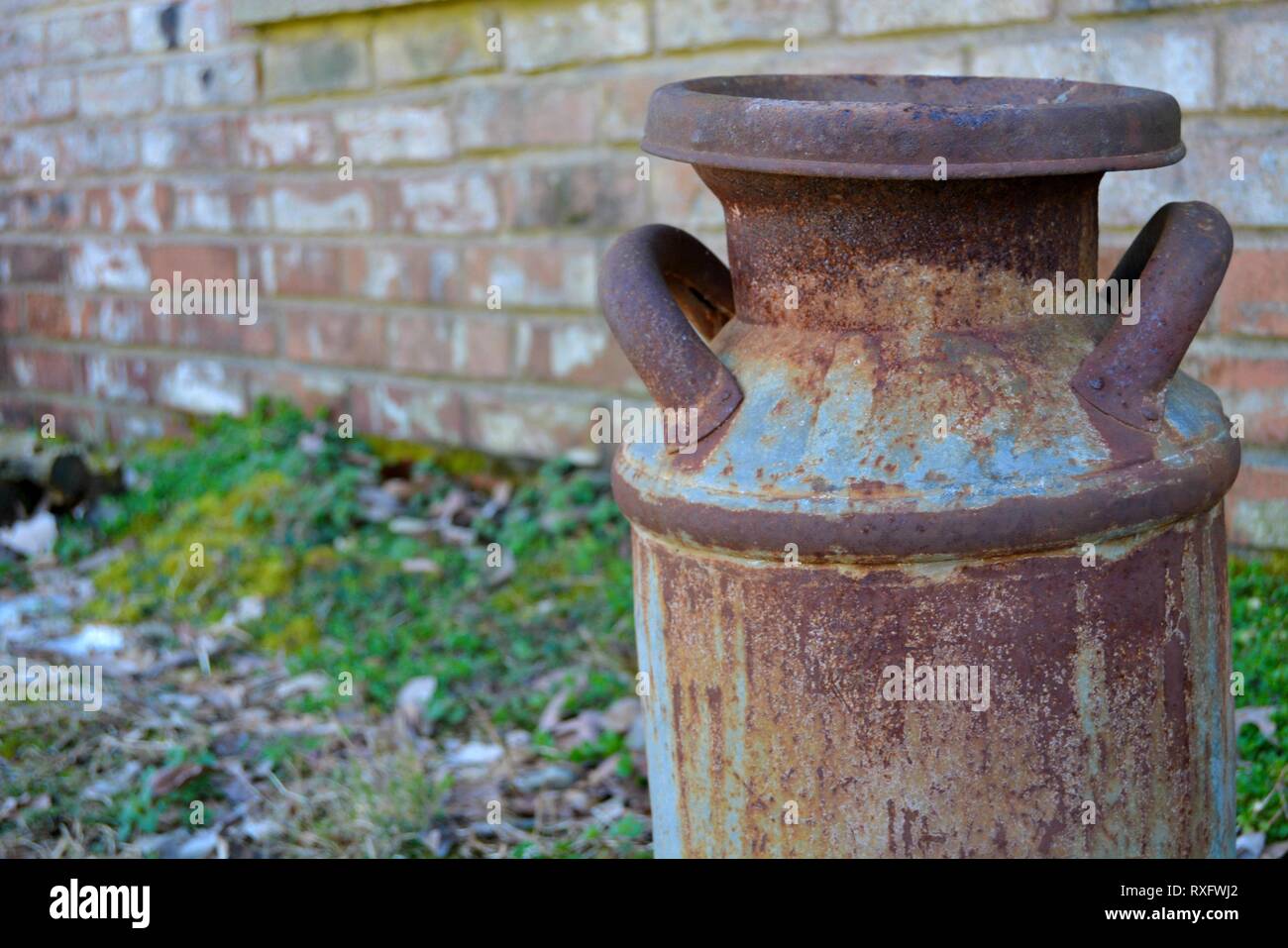 Old brown rusting milk can hi-res stock photography and images - Alamy