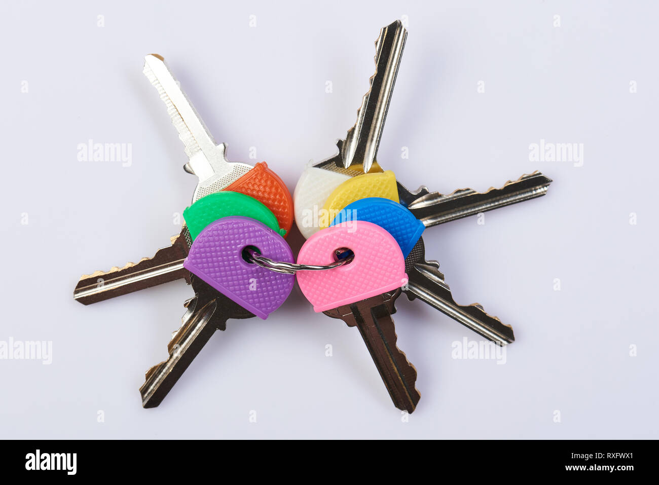 Set of colorful steel keys isolated on white background Stock Photo - Alamy