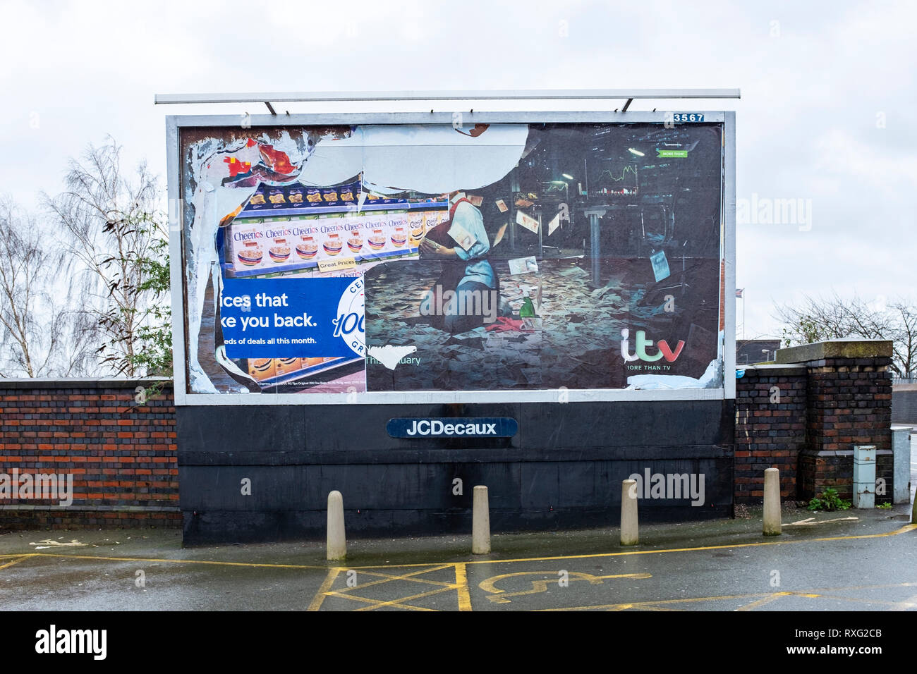 Confused message on ripped billboard in Crewe Cheshire UK Stock Photo ...