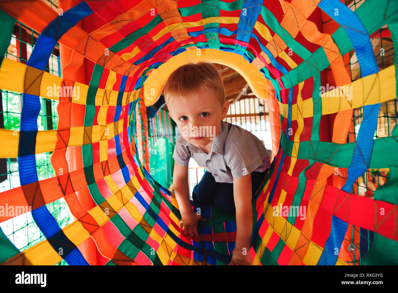 Boy playing on the playground, in the children's maze Stock Photo - Alamy