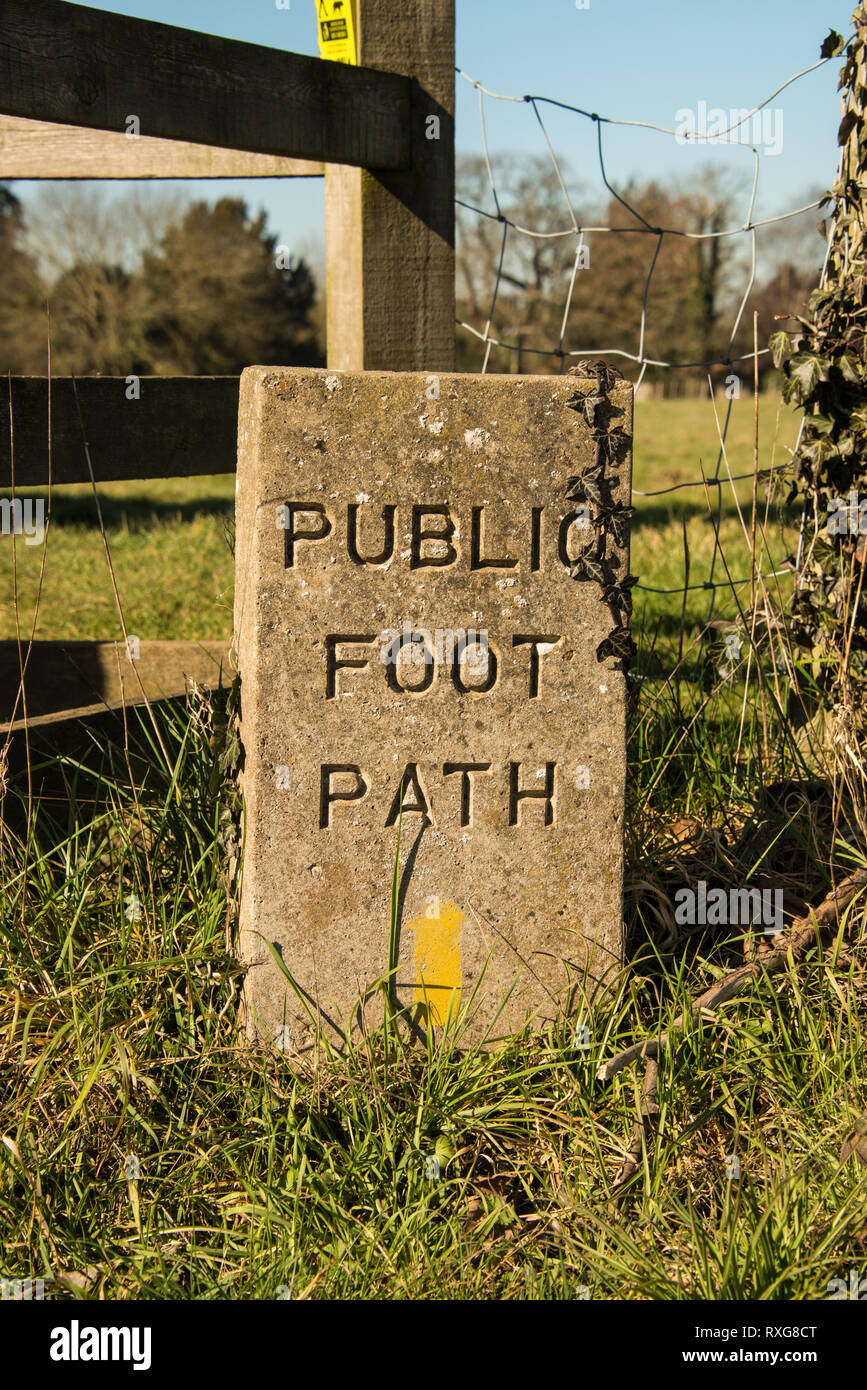 Public foot path stone marker Stock Photo - Alamy