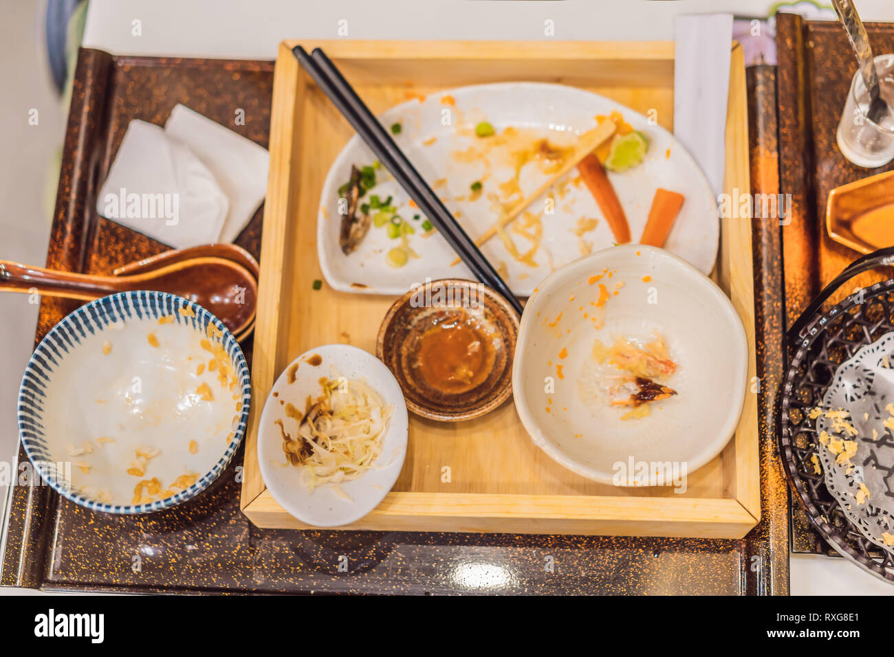 Messy table after meal in Japanese restaurant. Dirty, finish meal ...