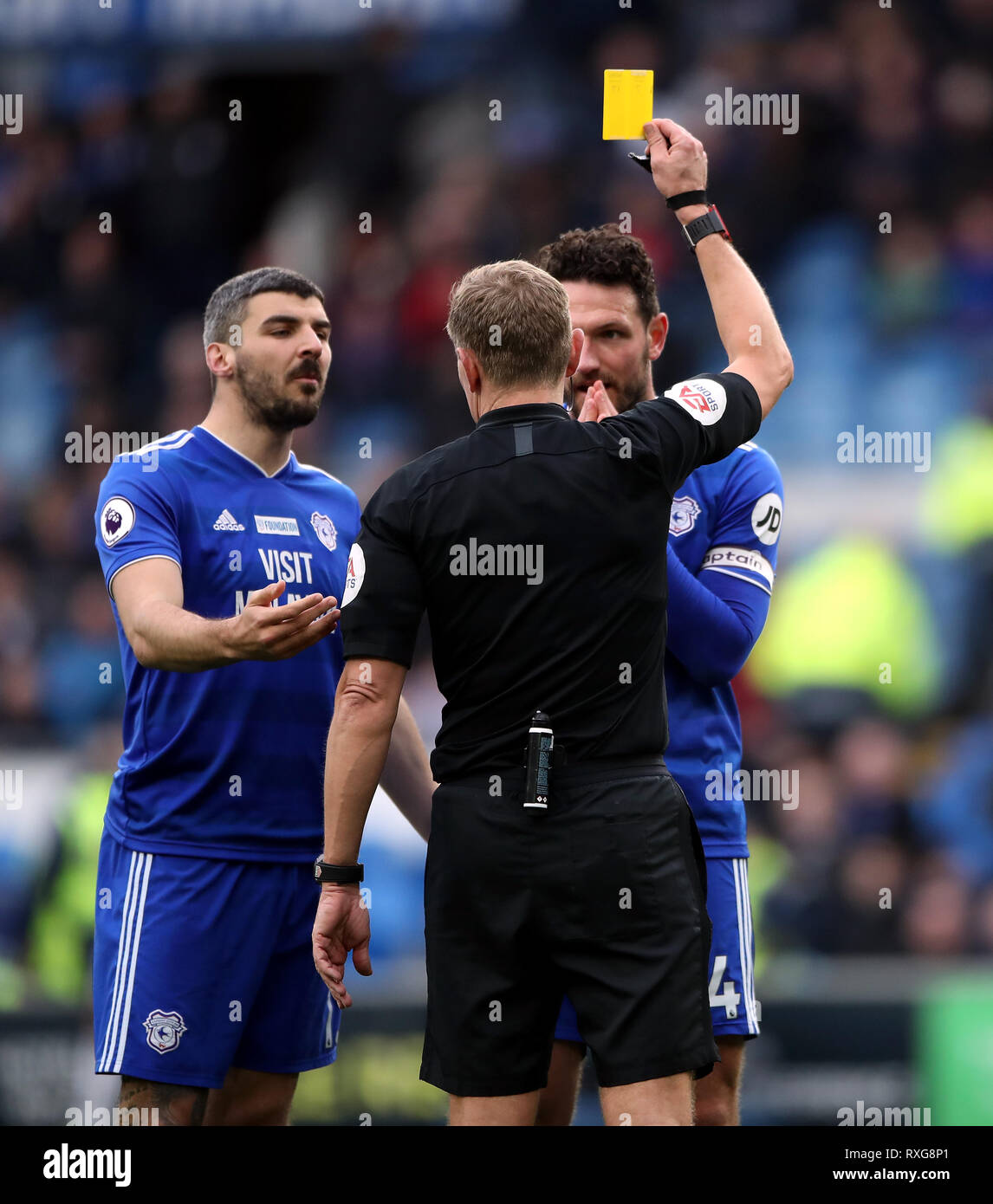 Cardiff City's Sean Morrison (right) is shown a yellow card by referee ...