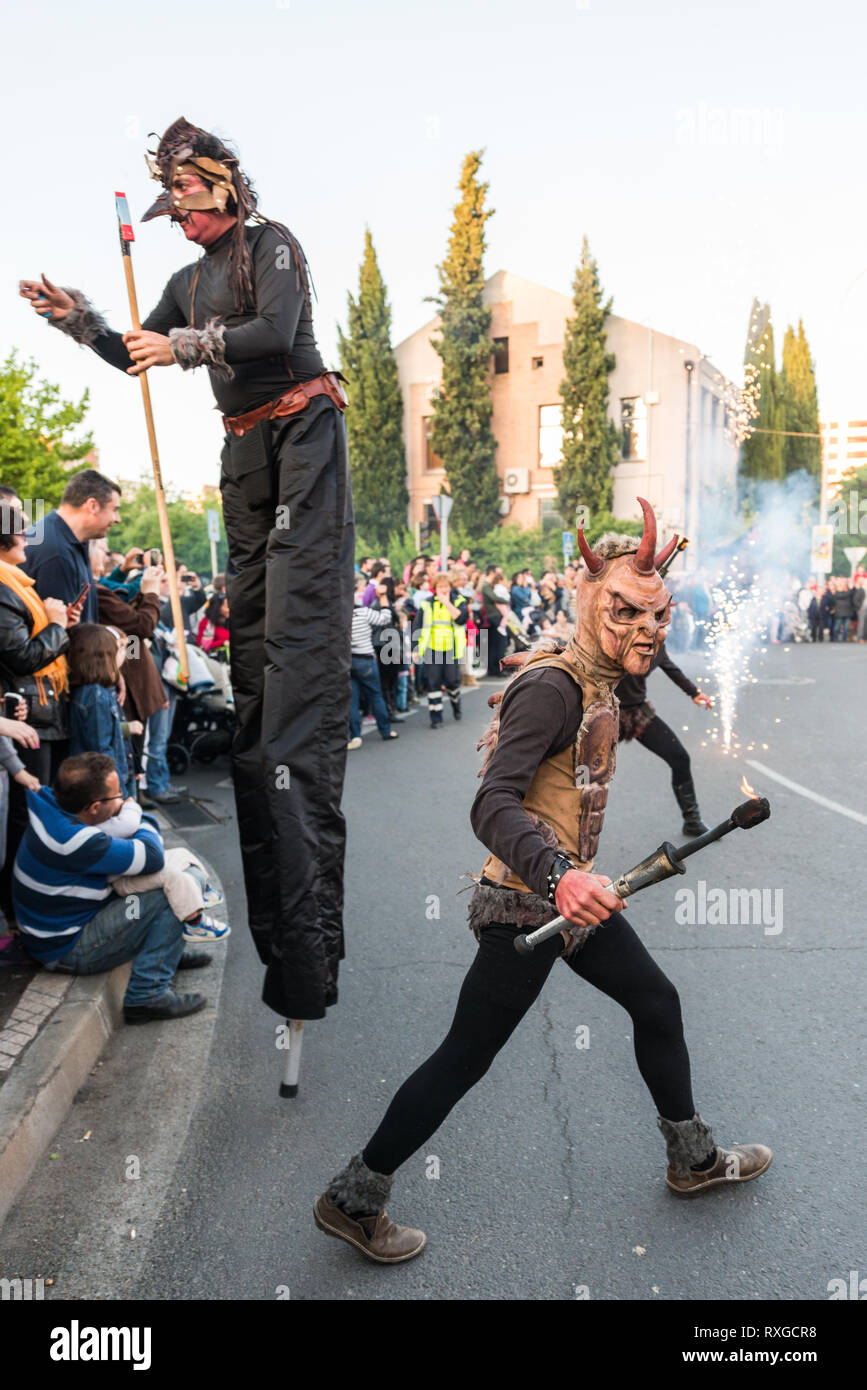 People masquerading as demons frightening people on the occasion of the ...