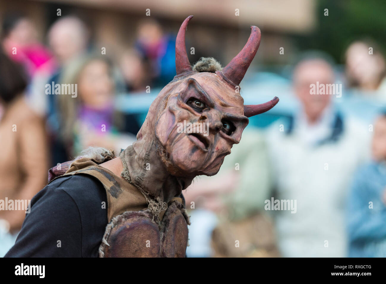 People masquerading as demons frightening people on the occasion of the ...