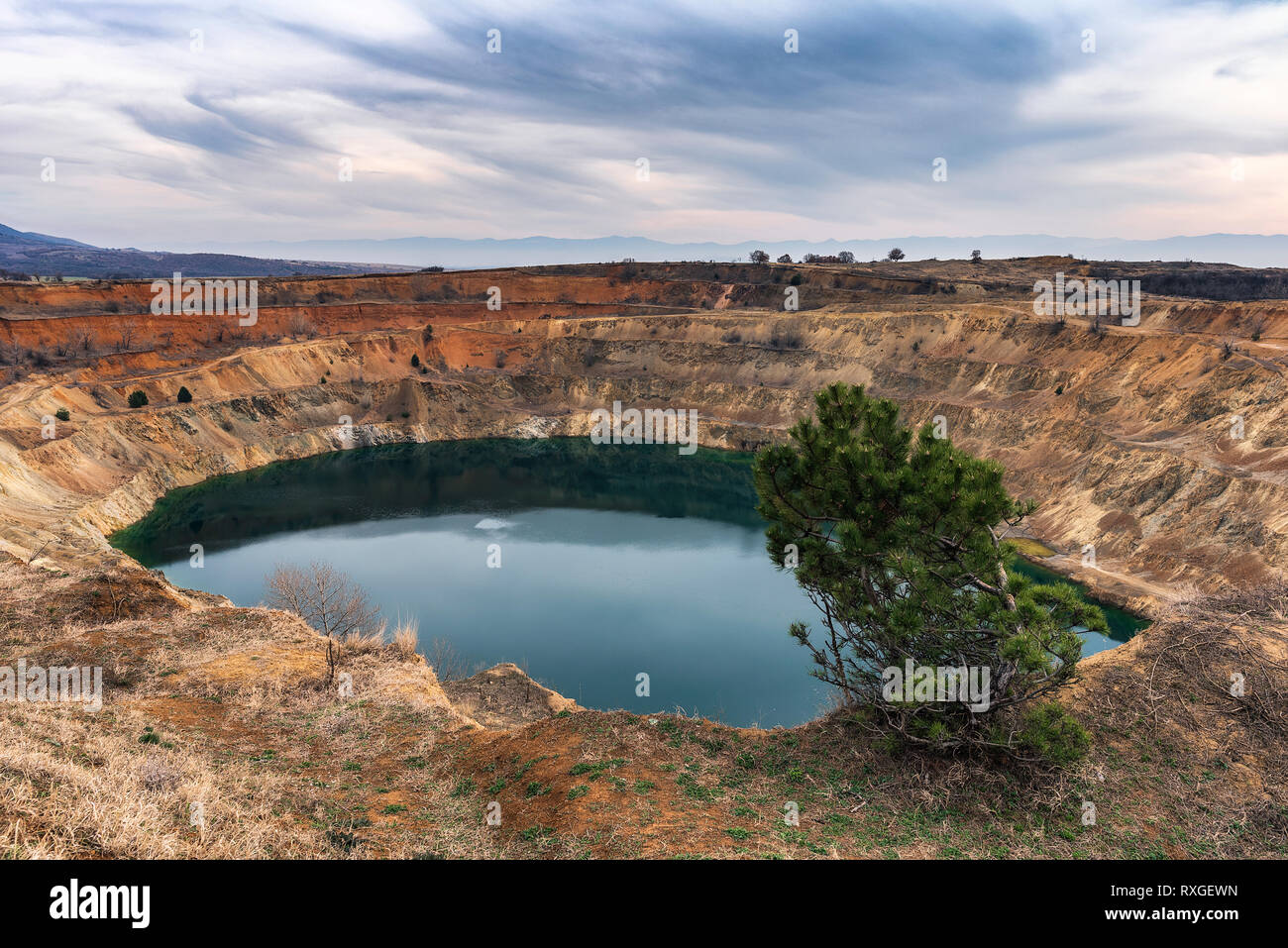 Abandoned cuprum mine in Bulgaria with lake inside near Tsar Asen ...