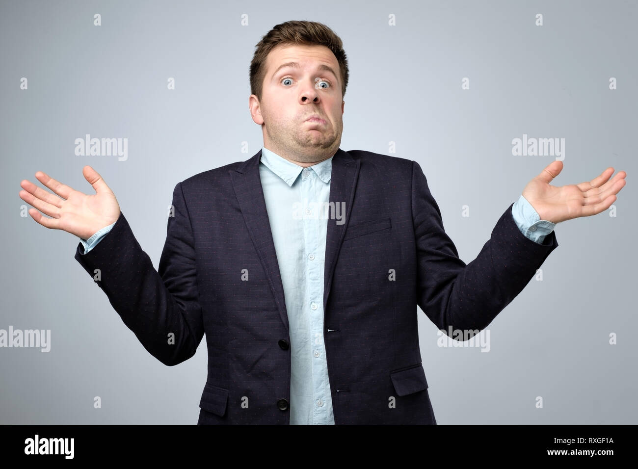 Man shrug in suit hi-res stock photography and images - Alamy