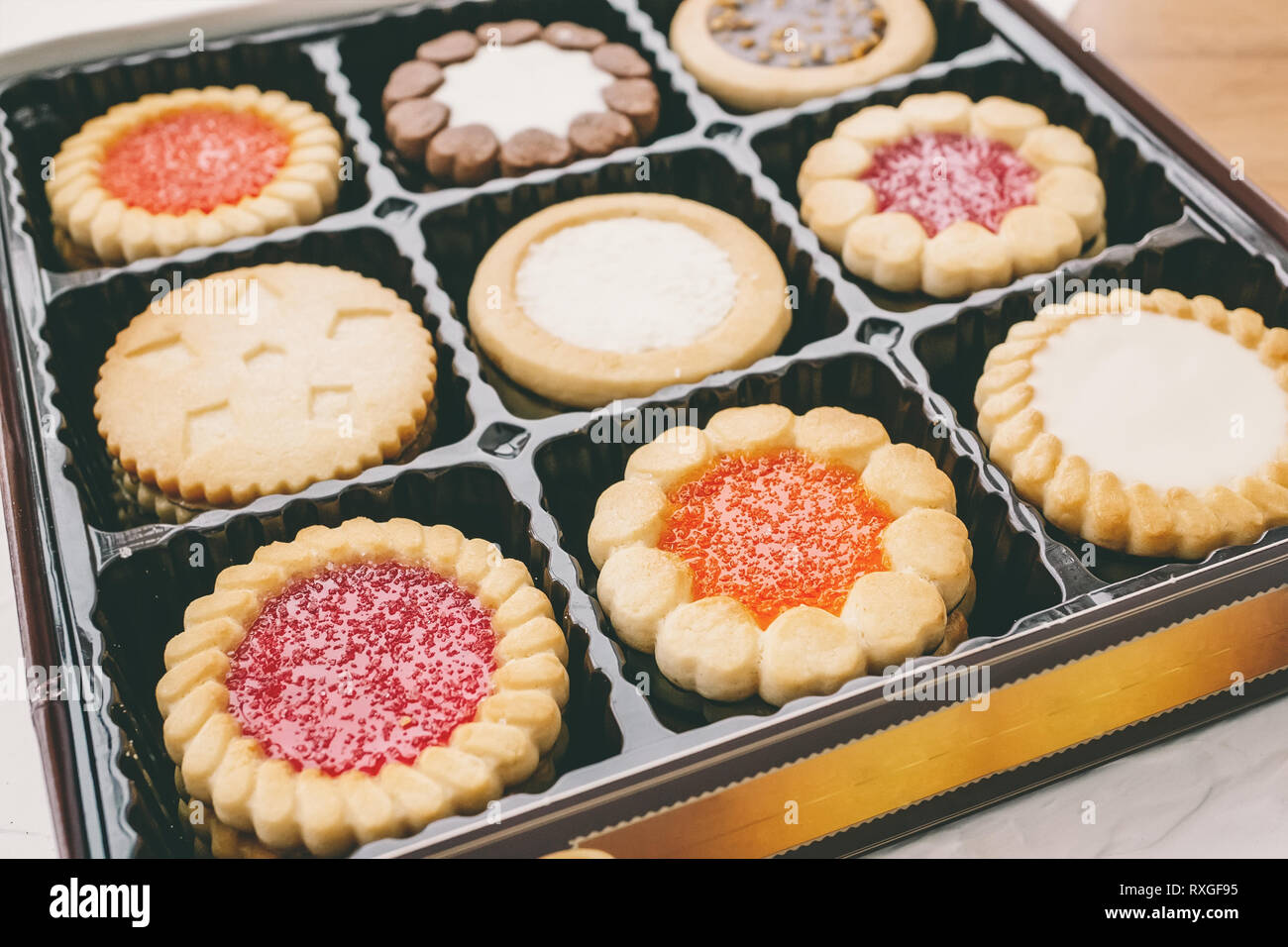 Homemade round biscuit cookies with various jelly toppings. Assorted ...