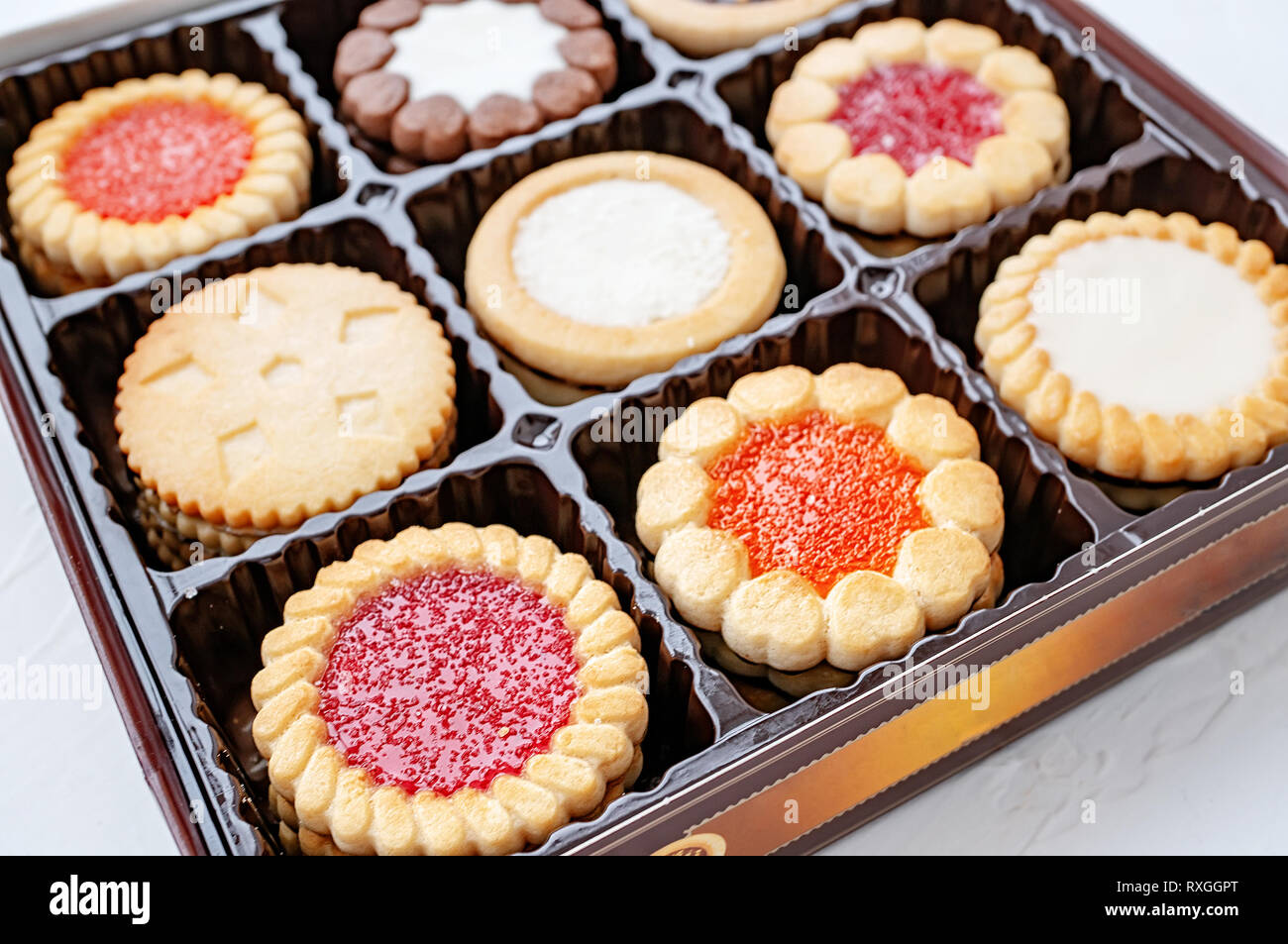 Homemade round biscuit cookies with various jelly toppings. Assorted ...