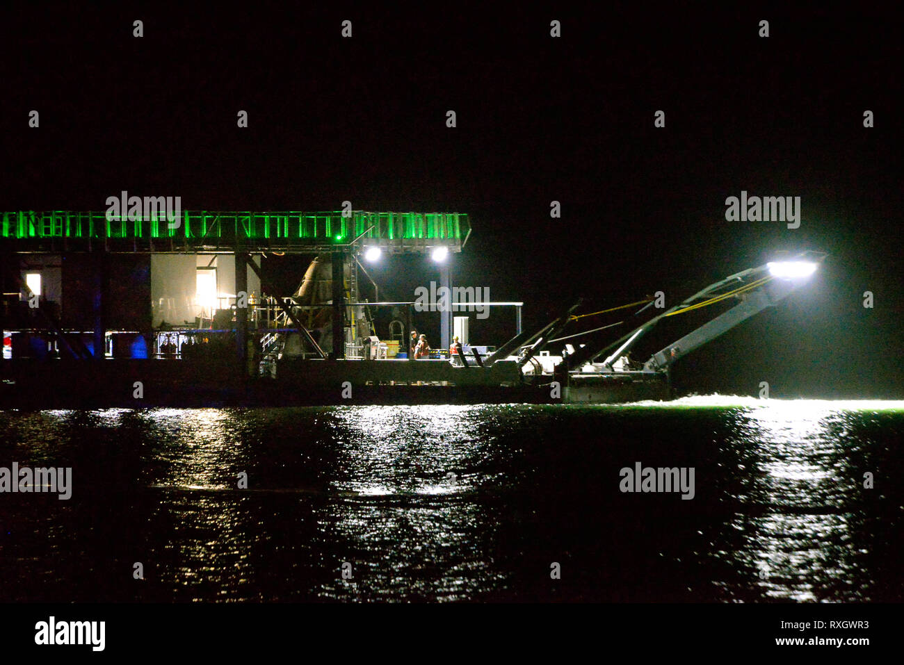 Port Canaveral. Florida. USA. March 9, 2019. In the dark SpaceX Dragon ...