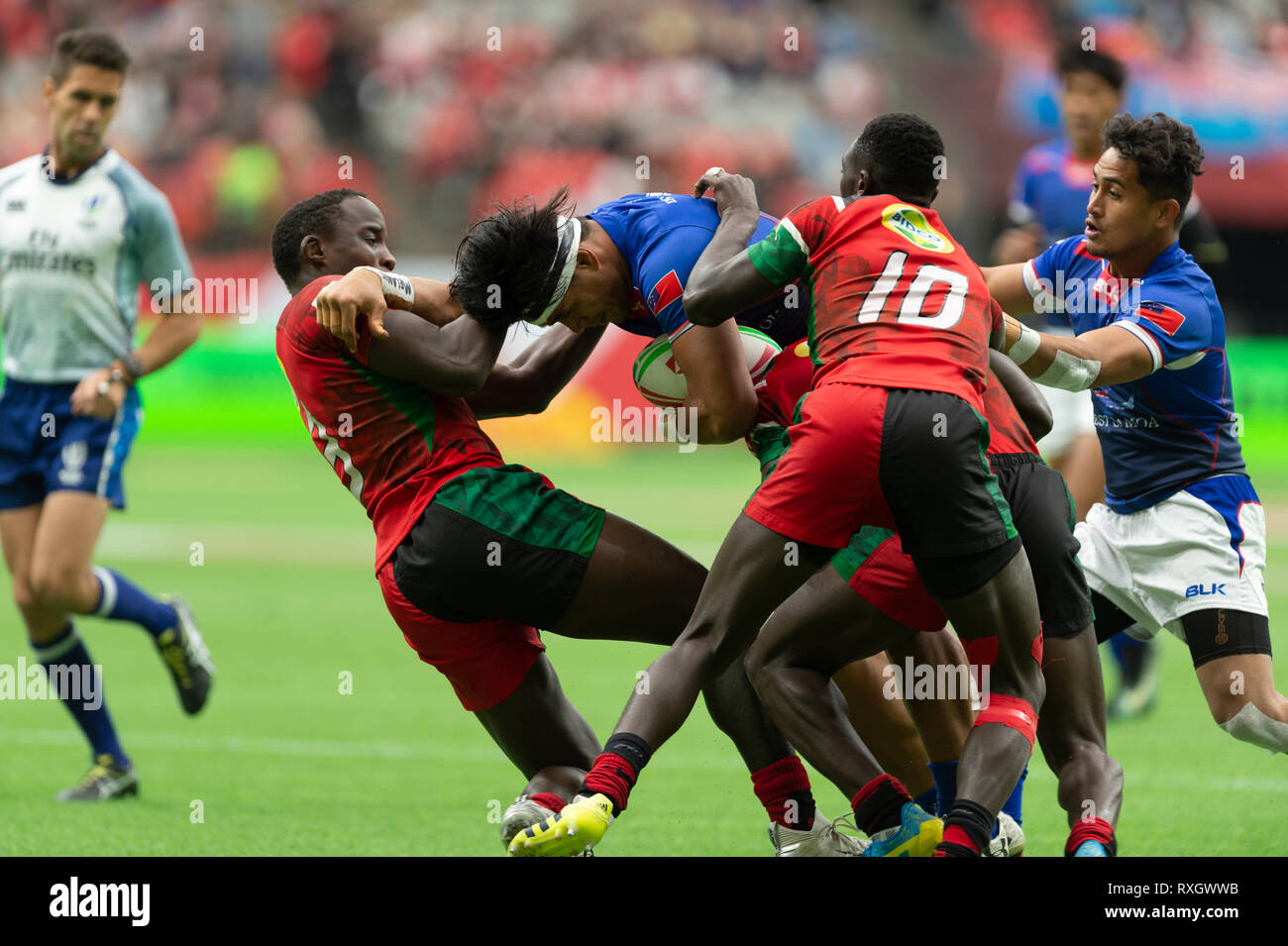 Vancouver, Canada. 9 March 2019. Tofatu Solia (blue) of Samoa, being ...