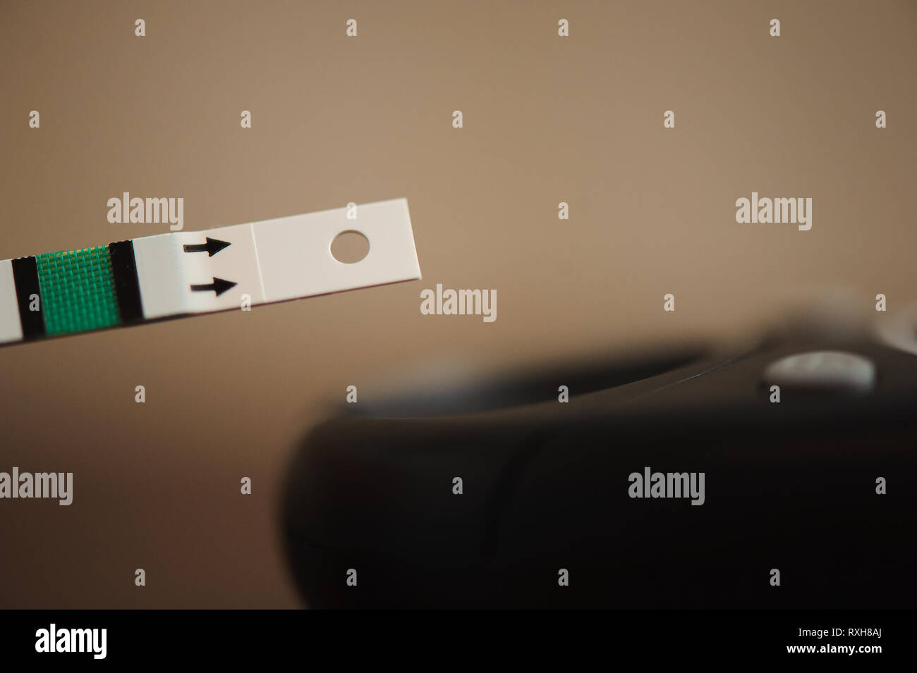 Diabetic patient doing glucose level blood test using ultra mini ...