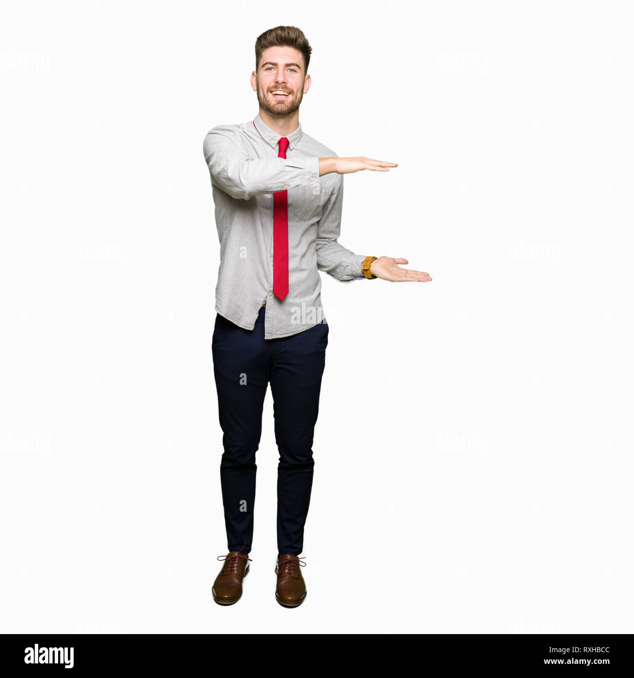 Young handsome business man gesturing with hands showing big and large ...