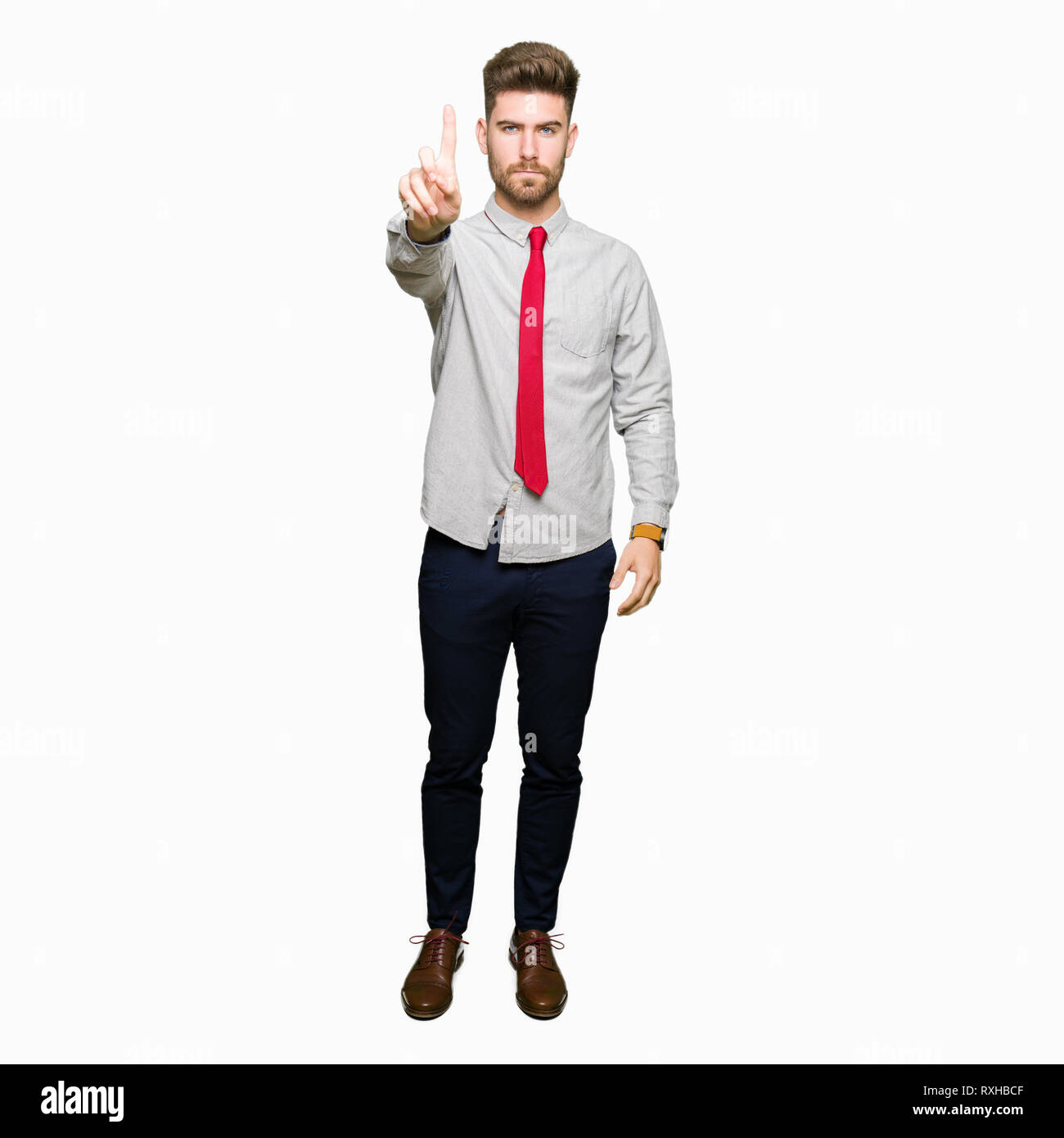 Young handsome business man Pointing with finger up and angry ...