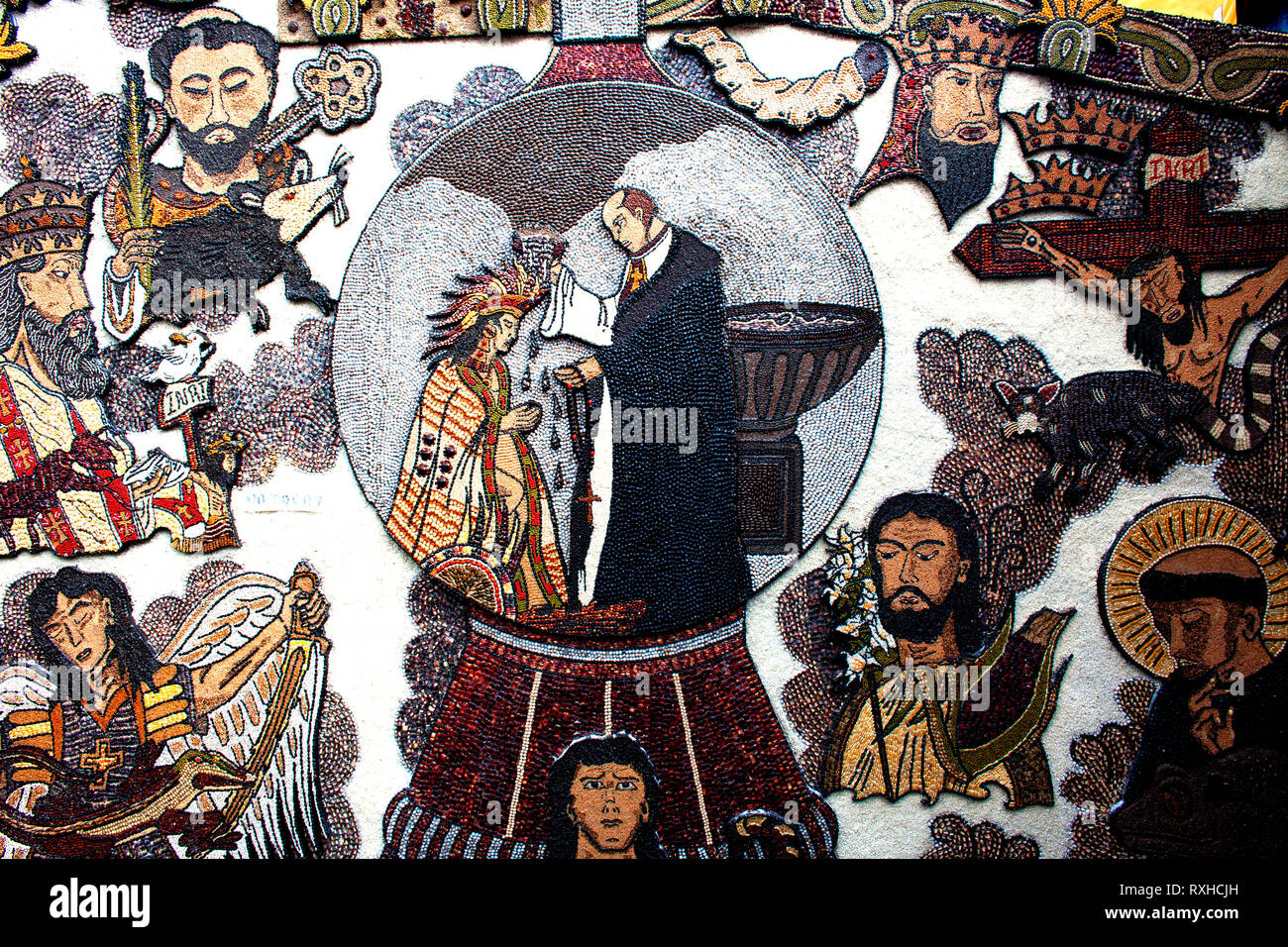 An image of a priest baptizing a Mexican indigenous decorates the door ...