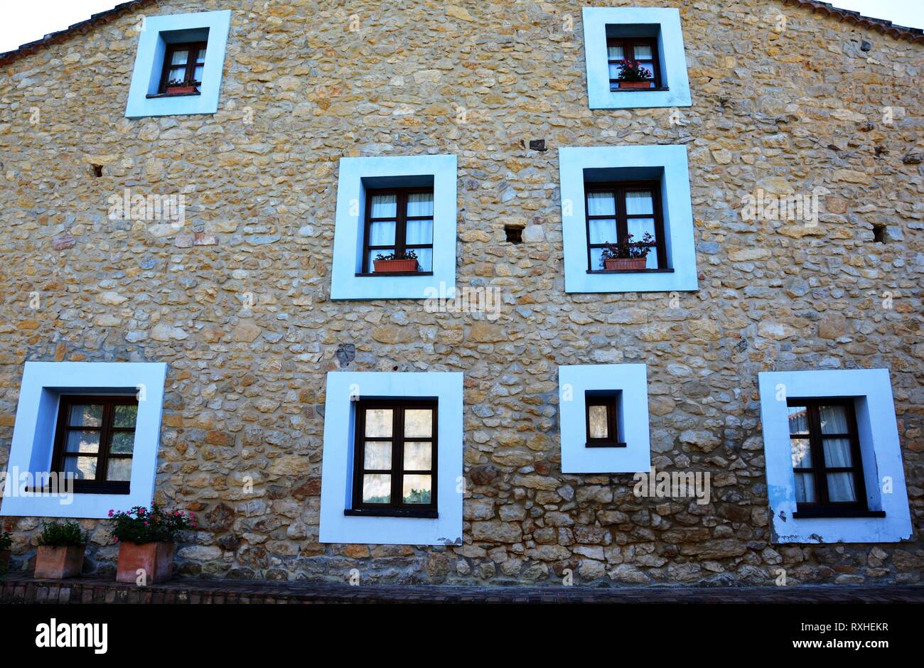 a house with the blue windows Stock Photo - Alamy
