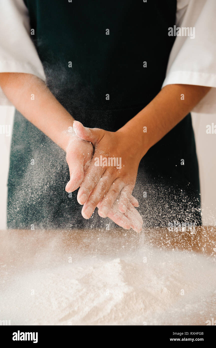 Chef preparing dough - cooking process, work with flour Stock Photo - Alamy