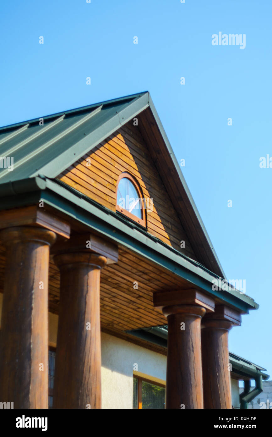 The Massive Wooden Columns of the Porch Entrance to the House of Thick ...