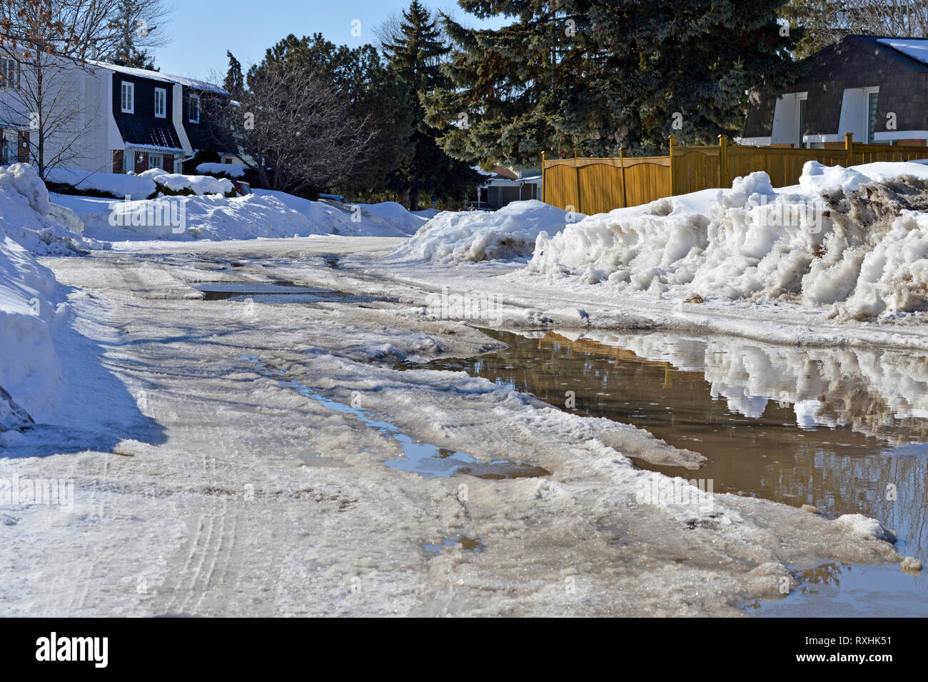 Image showing a road and huge puddles of pooling water due to an early ...