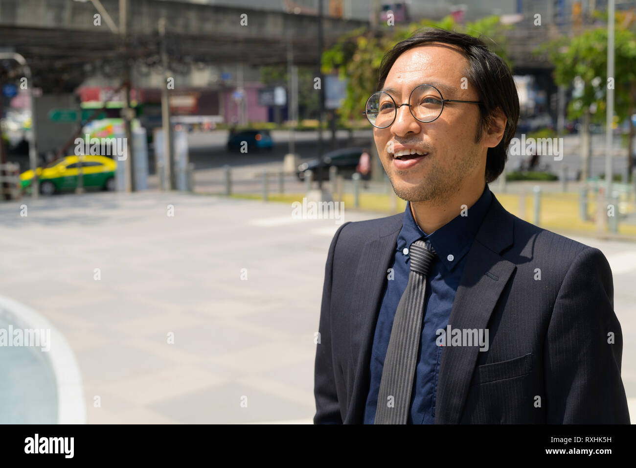 Face happy japanese businessman thinking hi-res stock photography and ...