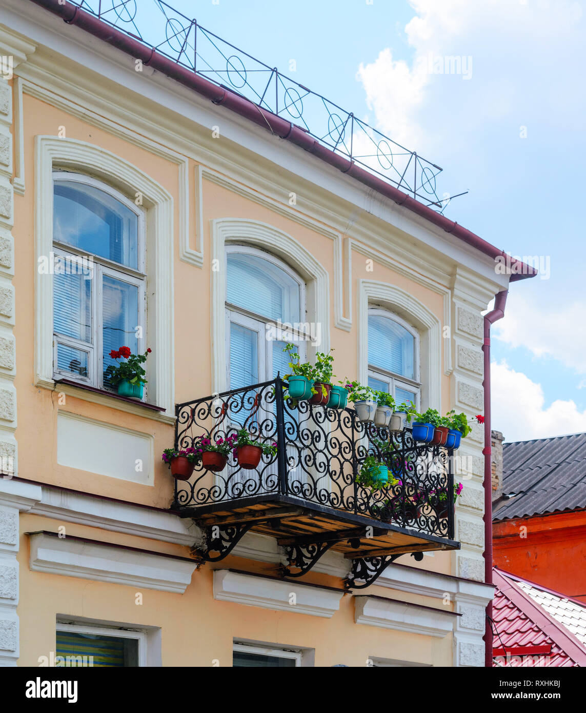 Old building with flowers on balcony hi-res stock photography and ...