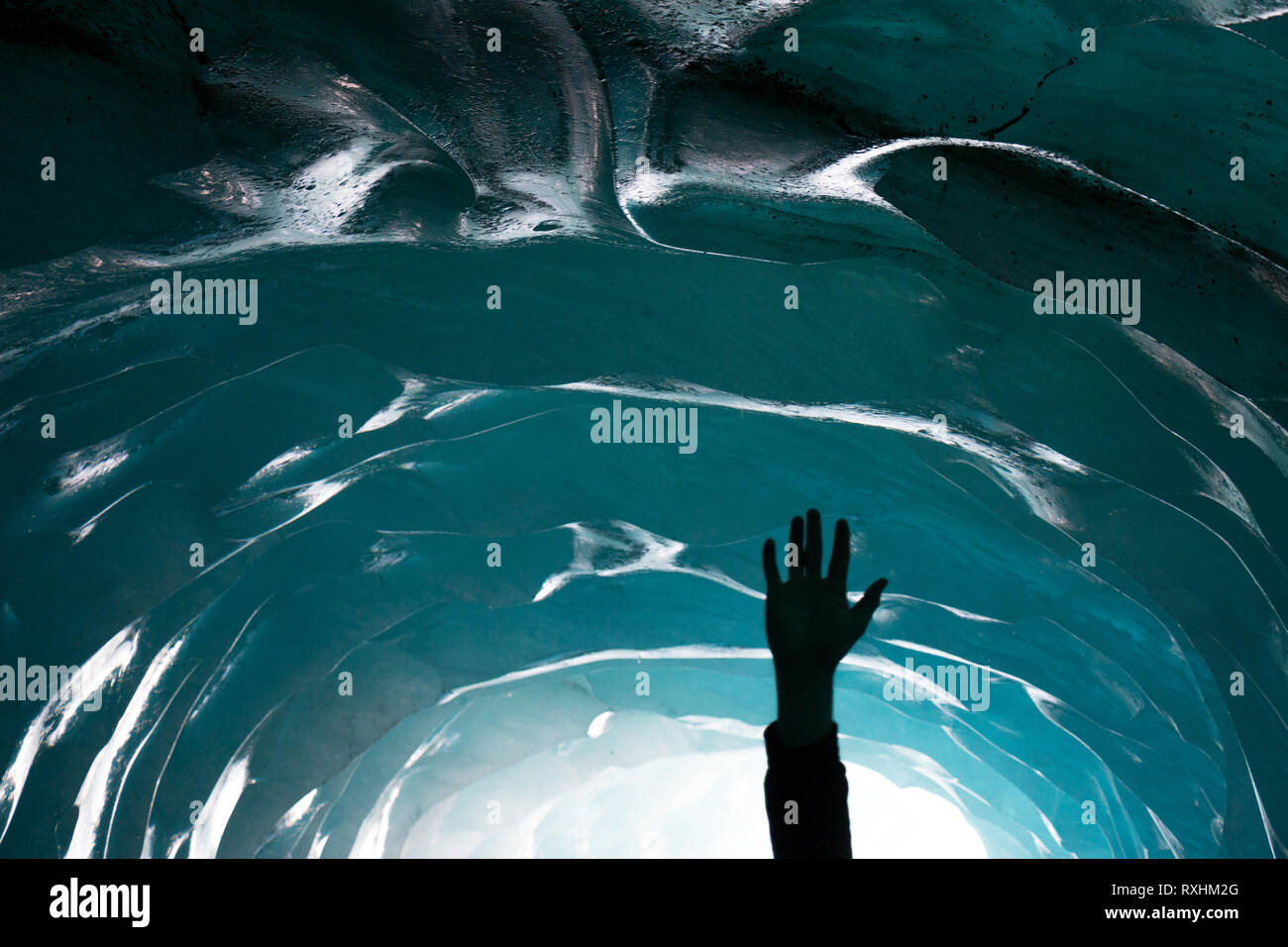 Person crying for help in an cold glacier ice cave Stock Photo - Alamy