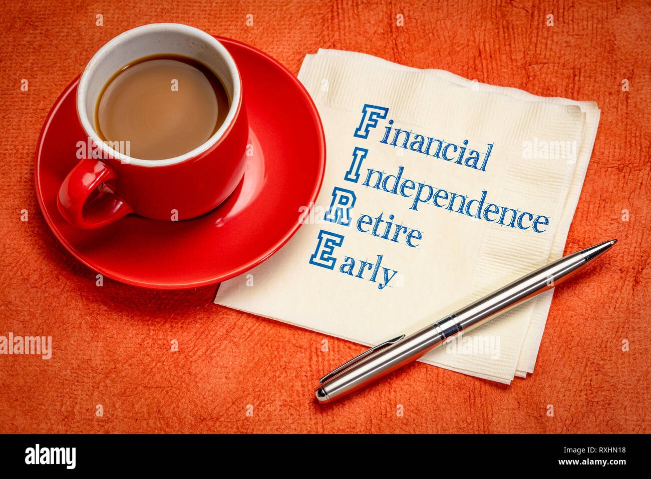 FIRE acronym - financial independence, retire early, handwriting on a ...