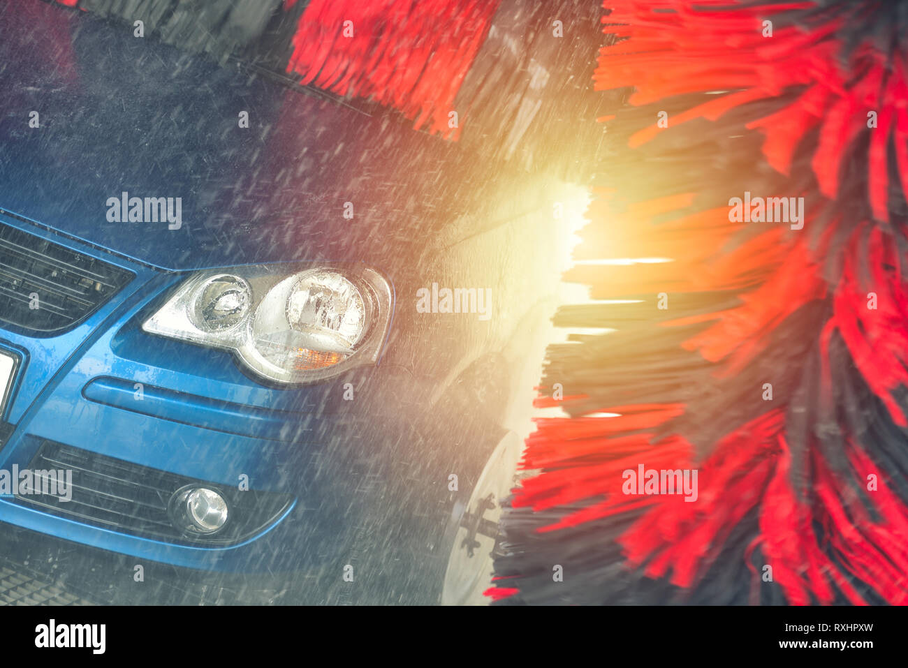 Automatic car wash in action. Car wash concept. Automated technology ...