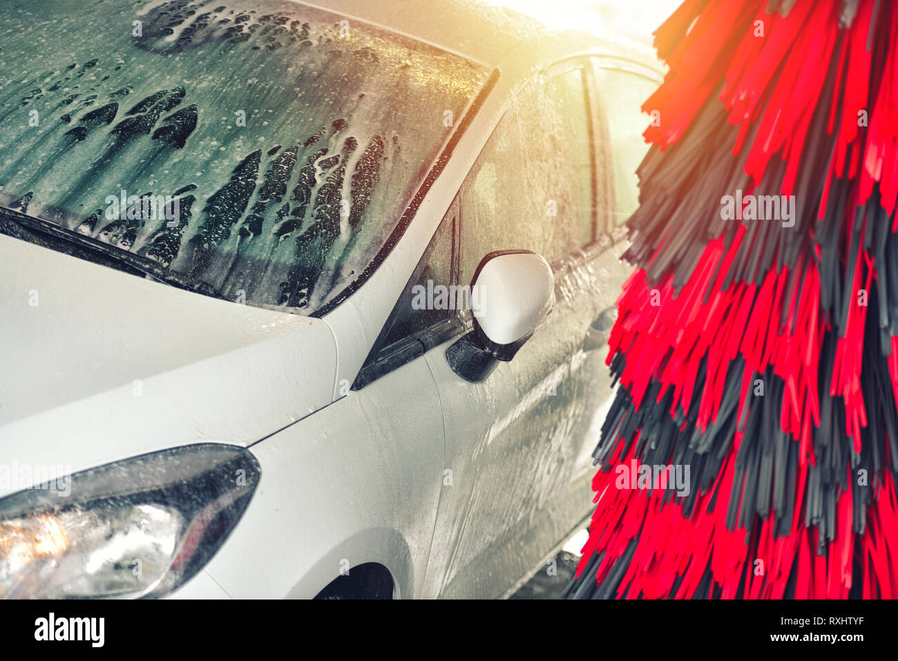 Automatic car wash in action. Car wash concept. Automated technology ...