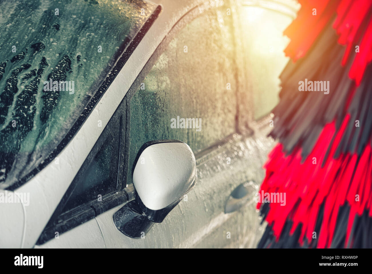 Automatic car wash in action. Car wash concept. Automated technology ...