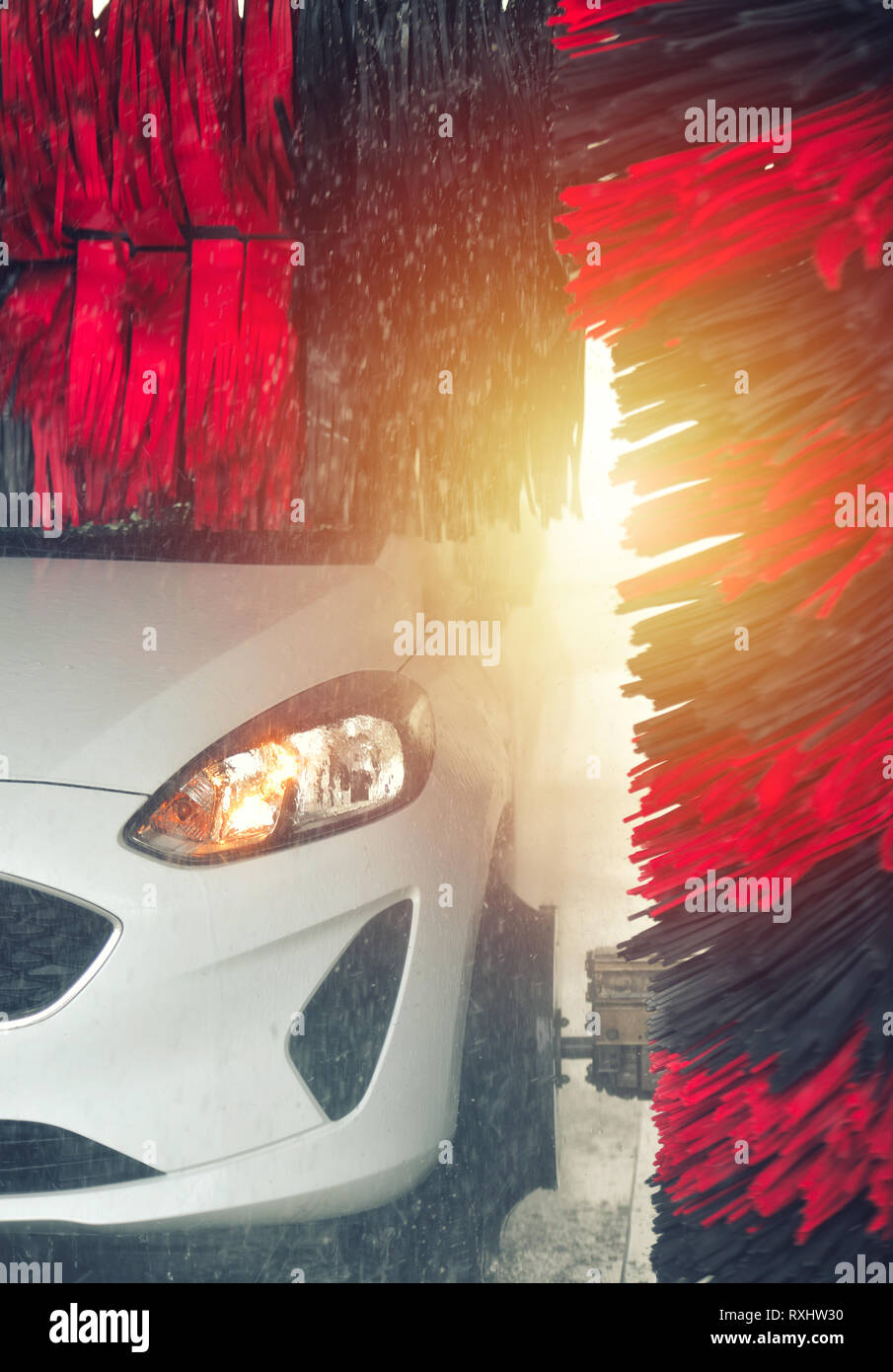 Automatic car wash in action. Car wash concept. Automated technology ...