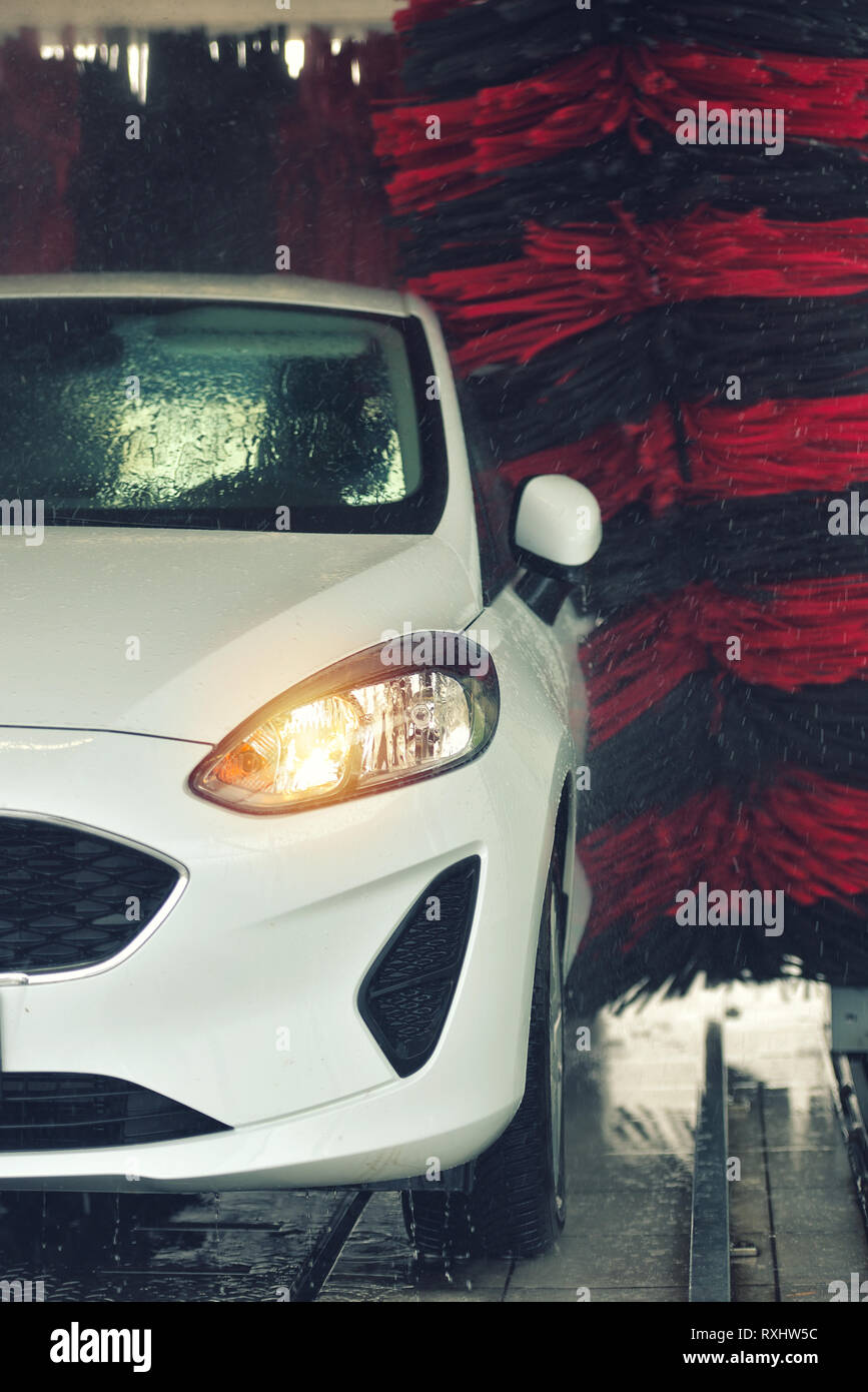 Automatic car wash in action. Car wash concept. Automated technology ...