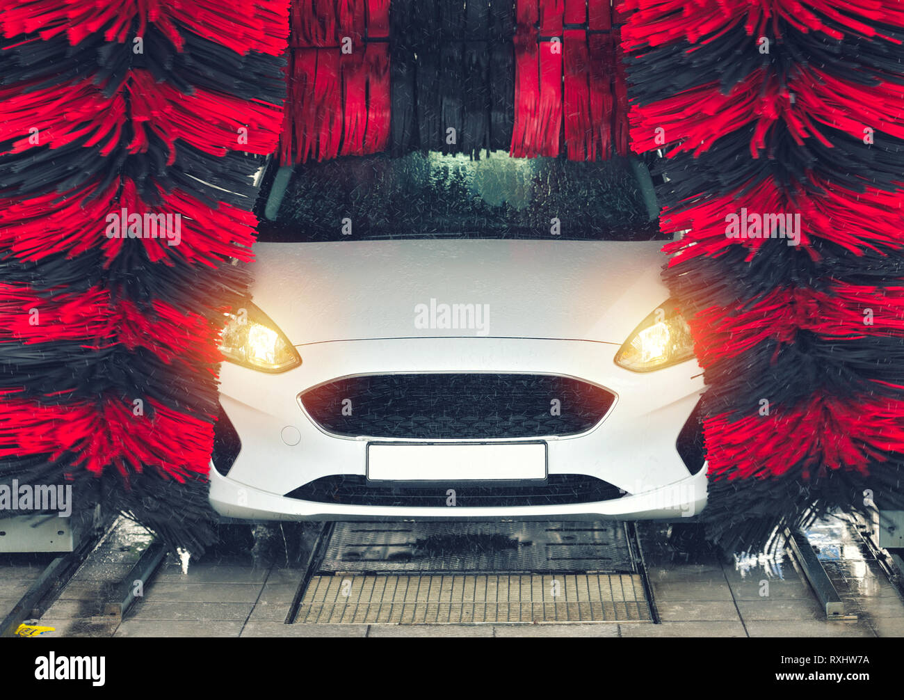 Automatic car wash in action. Car wash concept. Automated technology ...