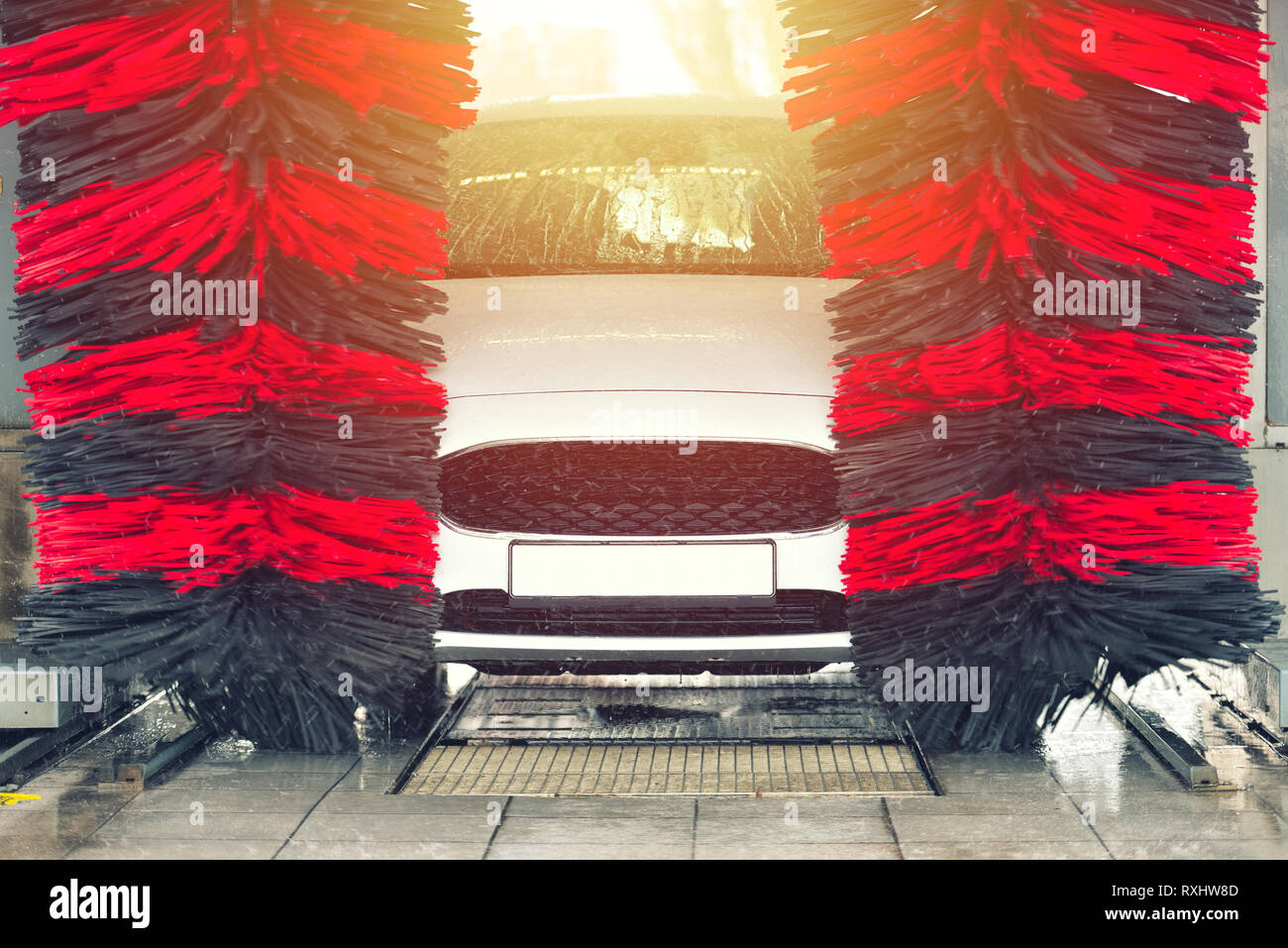 Automatic car wash in action. Car wash concept. Automated technology ...