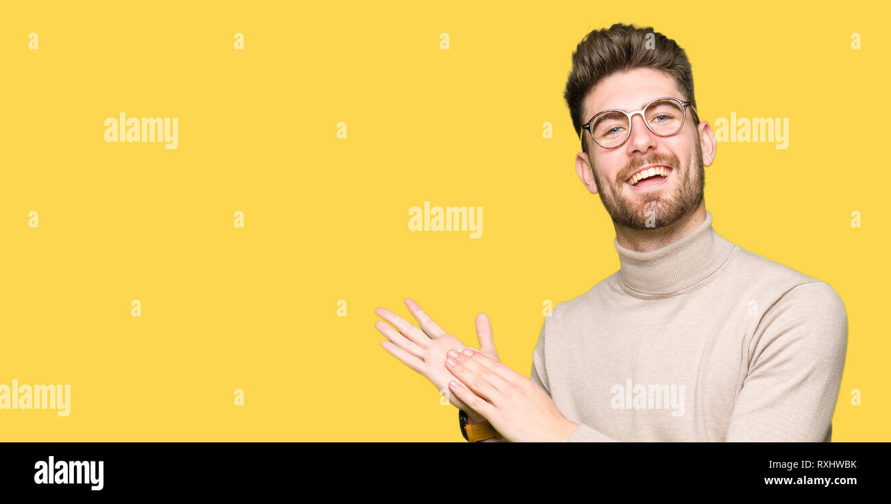 Young handsome business man wearing glasses Clapping and applauding ...