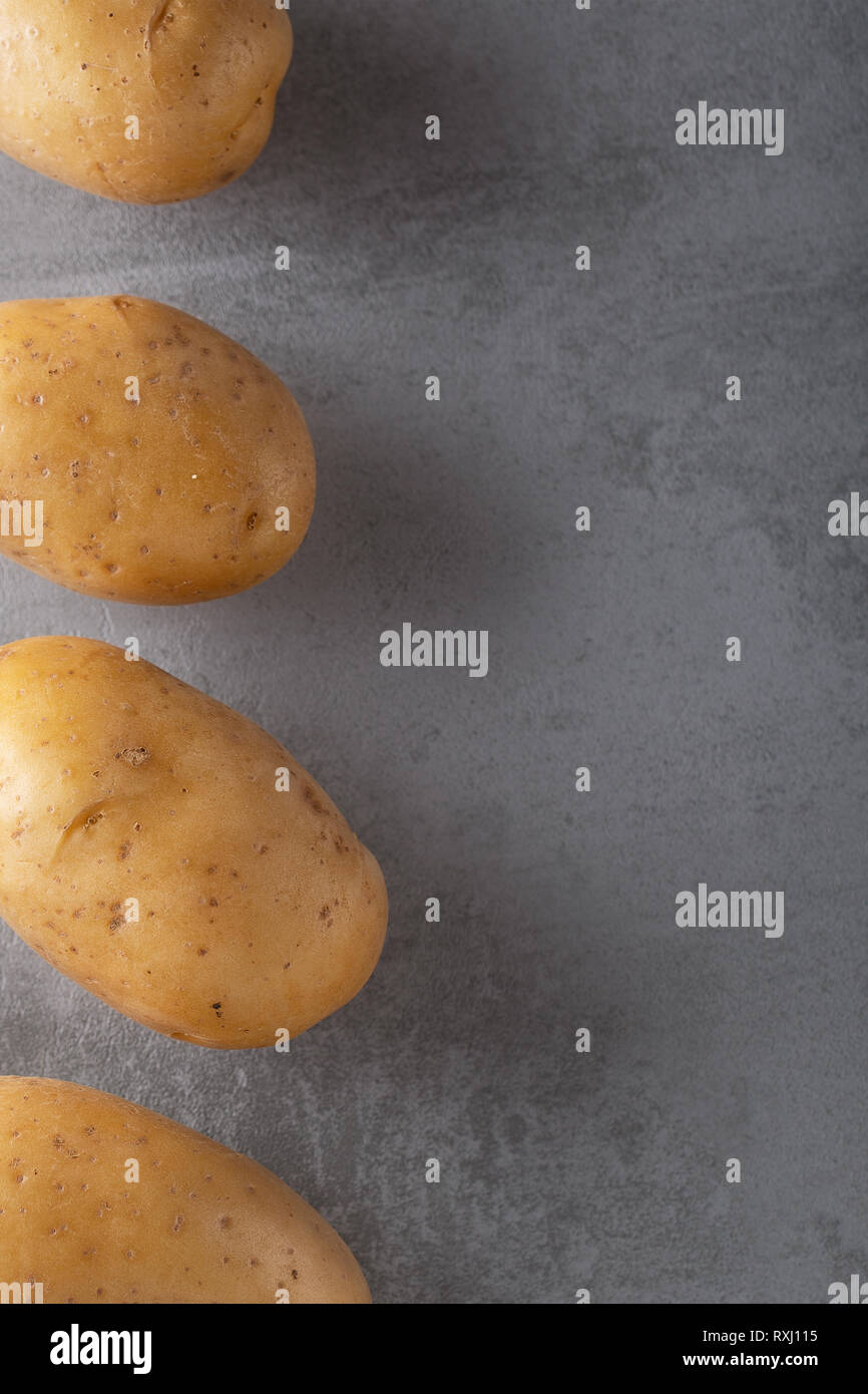 Tasty whole potatoes flat lay. Fresh legums as healthy food. Soft focus ...