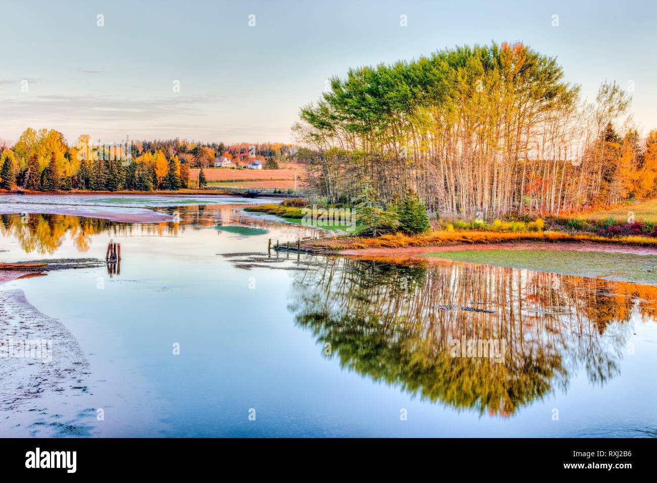 Fall colors reflected in DeSable River, Prince Edward Island, Canada ...