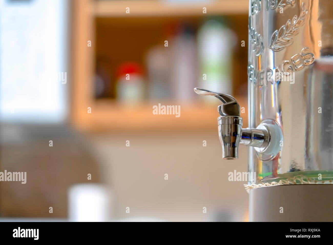 A glass beverage dispenser inside a kitchen Stock Photo - Alamy