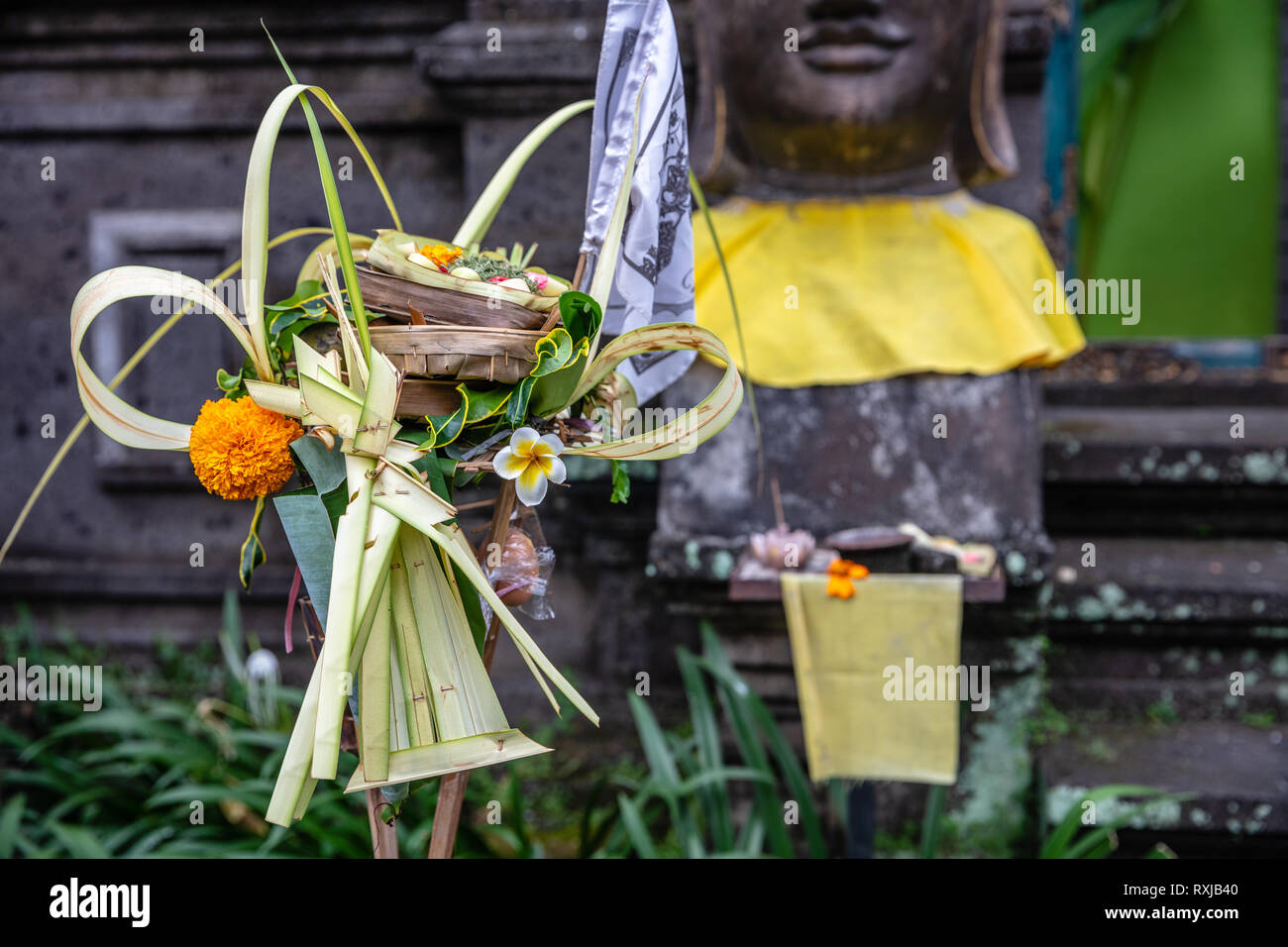 Balinese Hindu elevated offerings with canang sari for spirits for ...