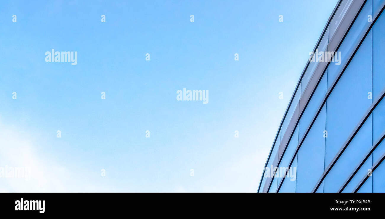 Bright sky and blue glass windows of a building Stock Photo - Alamy