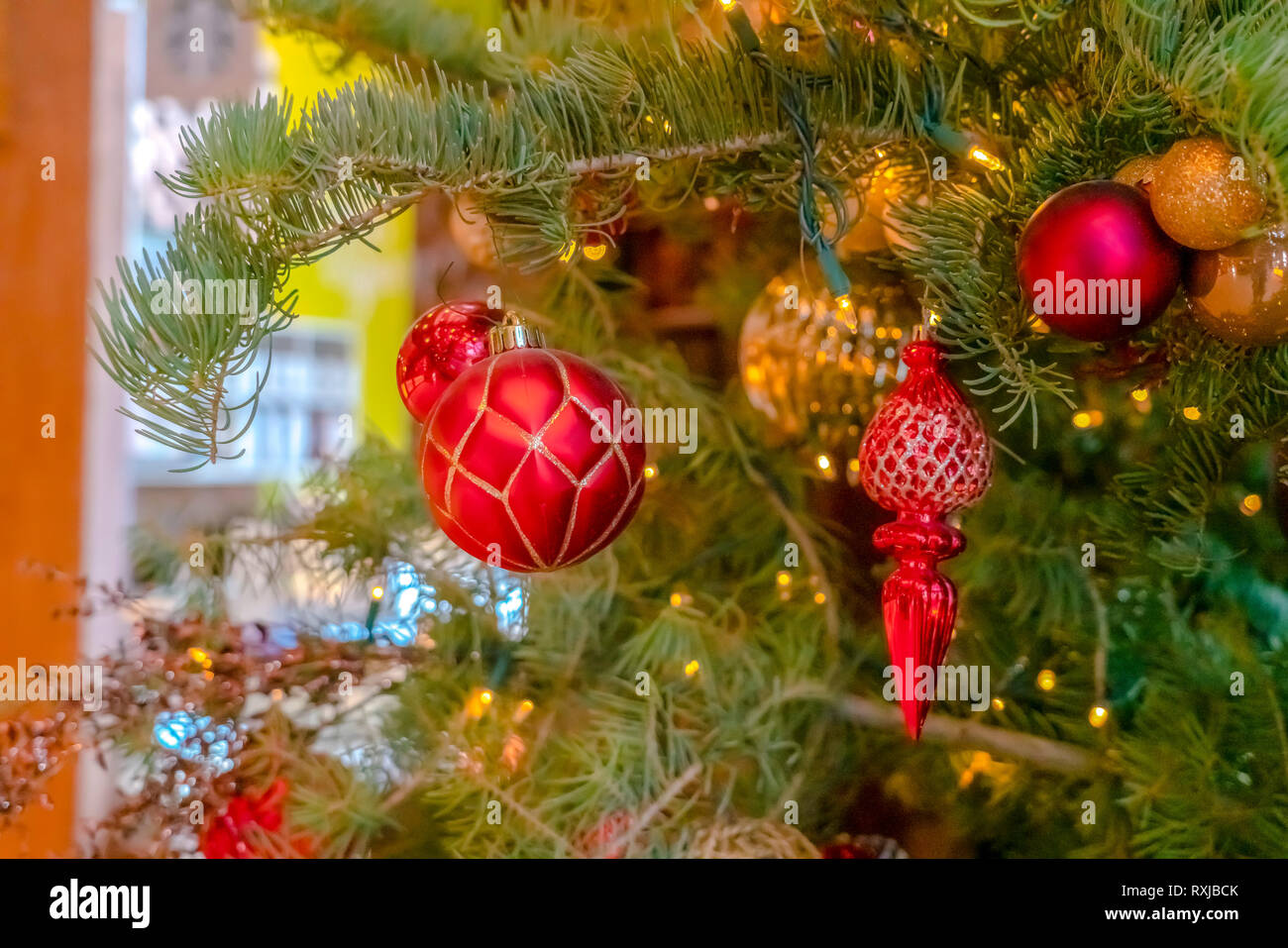 Christmas tree with red and gold decorations Stock Photo - Alamy